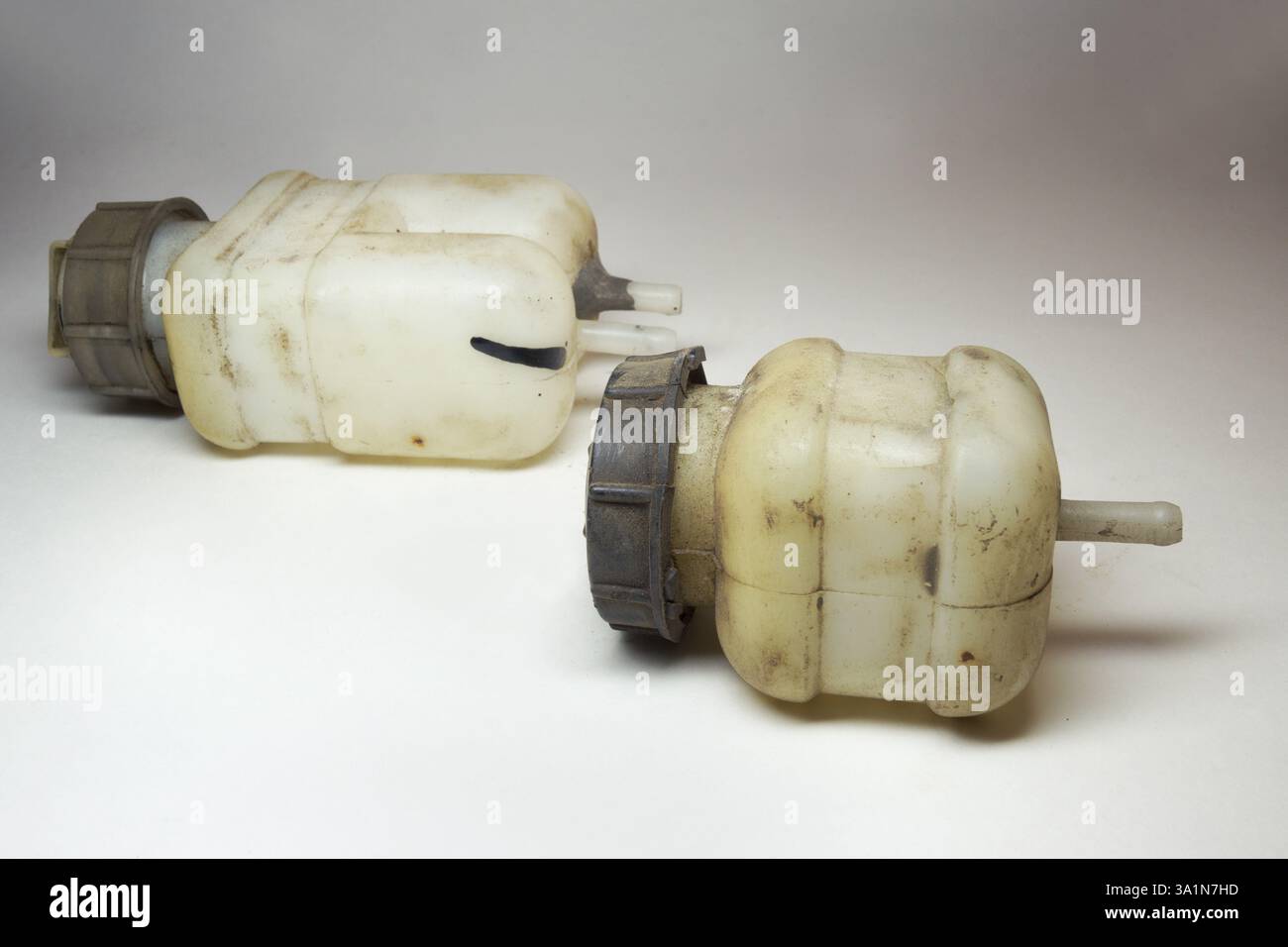 car fluid tanks of brake system and hydraulic clutch, old, worn out ...