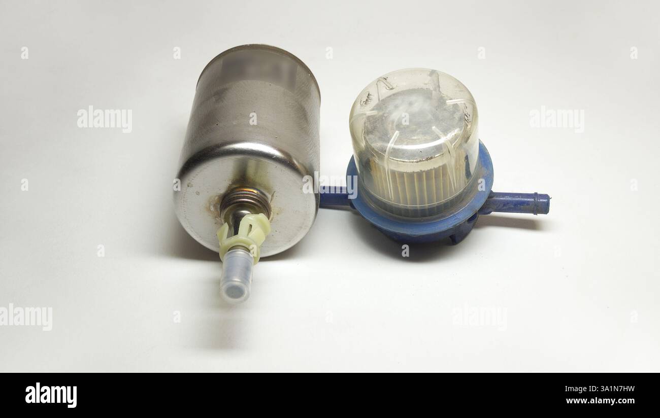 fuel filters pair, in-line, old, plastic and metal, dismantled through ...