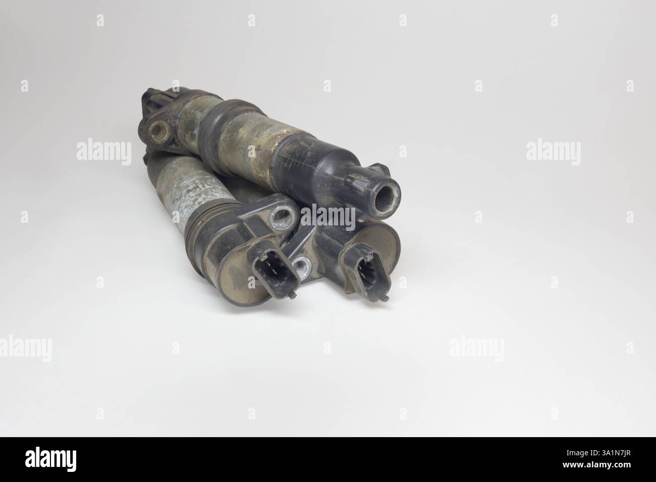 coil on plug coils, piled, showing 3-prong blade male terminal. on ...