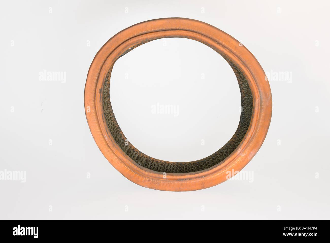 car round air filter, with clogged up paper media and metal mesh on ...