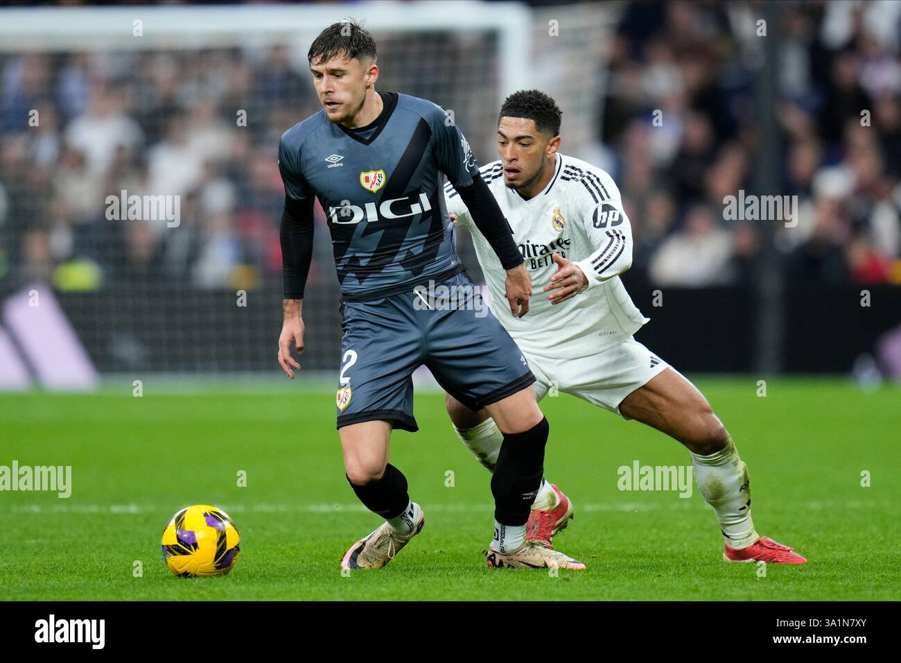 Andrei Florin Ratiu of Rayo Vallecano and Jude Bellingham of Real ...