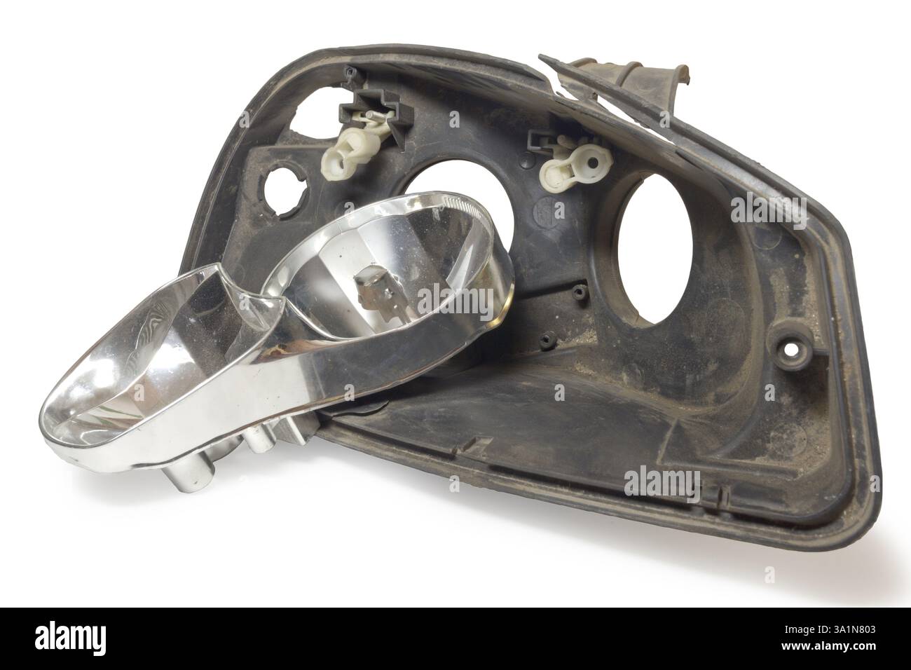 disassembled headlight. cracked black plastic housing and non-parabolic ...