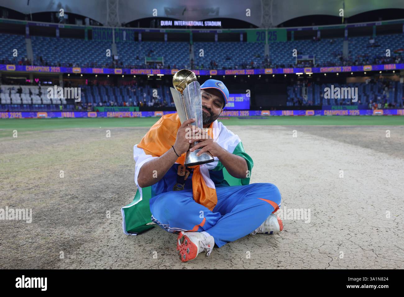 India's captain Rohit Sharma poses with the winners trophy after ...