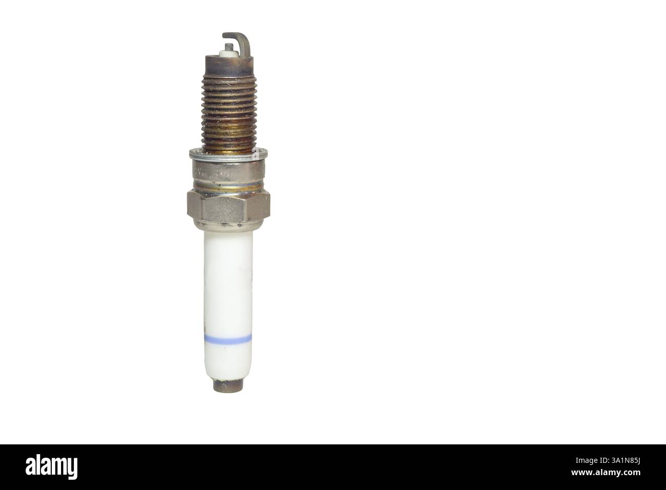 used spark plug, blue strip on body of white insulator. isolated on ...