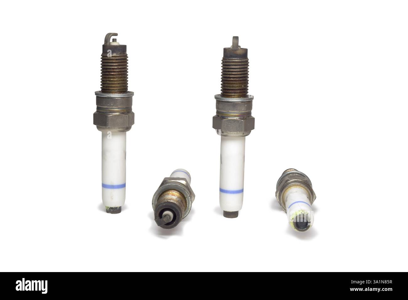 spark plugs kit, showing all sides, old. on white background, with ...