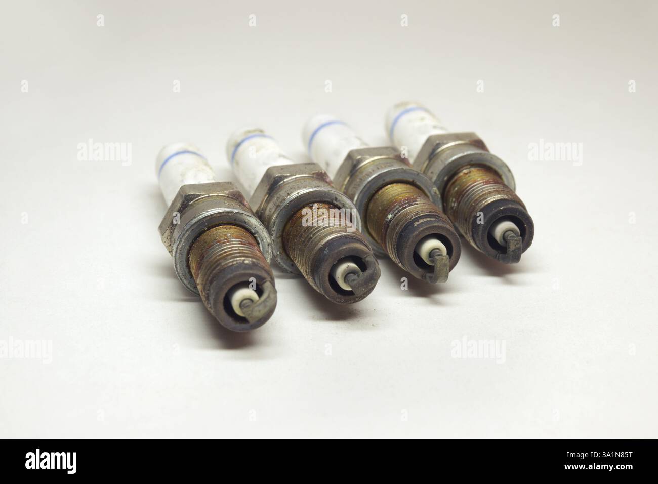 copper spark plugs set. showing worn electrodes Stock Photo - Alamy