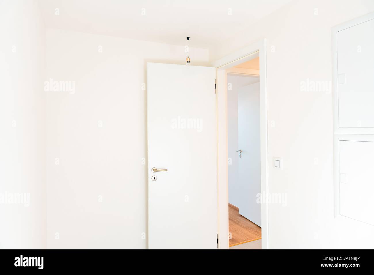 Bright modern technical room with open white doors, housing home ...