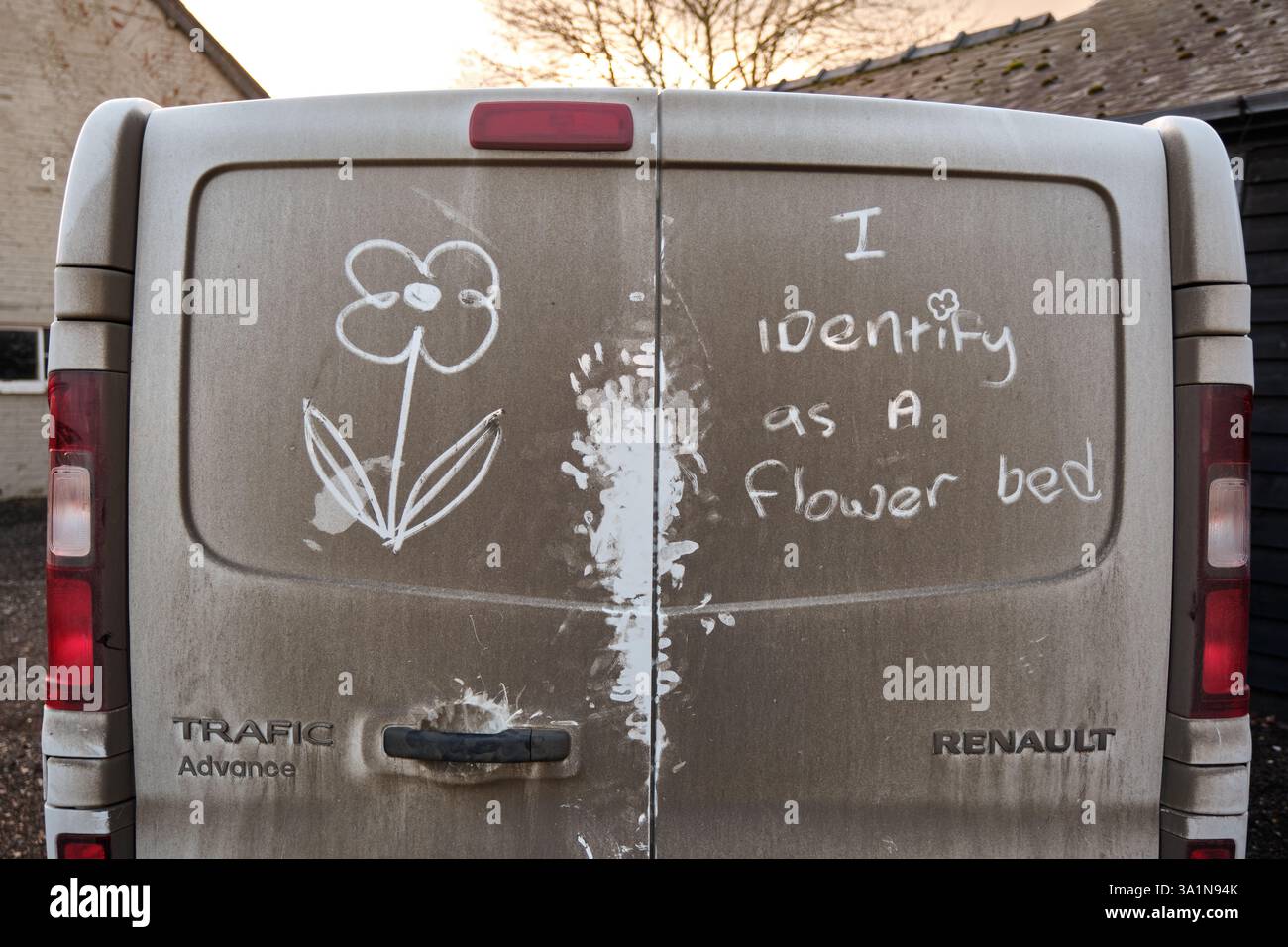 The back of an extremely dirty white work van with the humorous ...