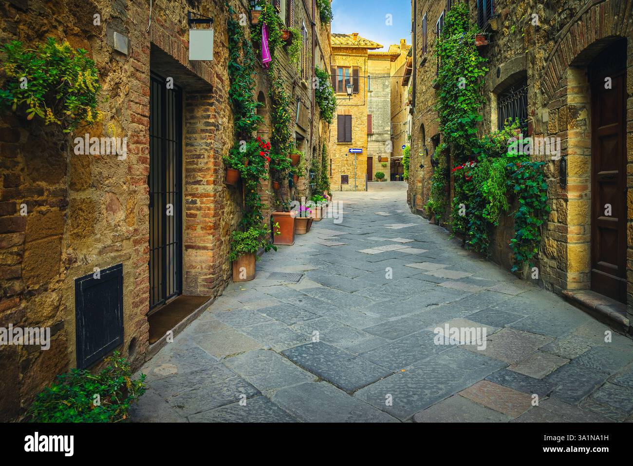 Picturesque cozy narrow paved street view with orderly old stone houses ...