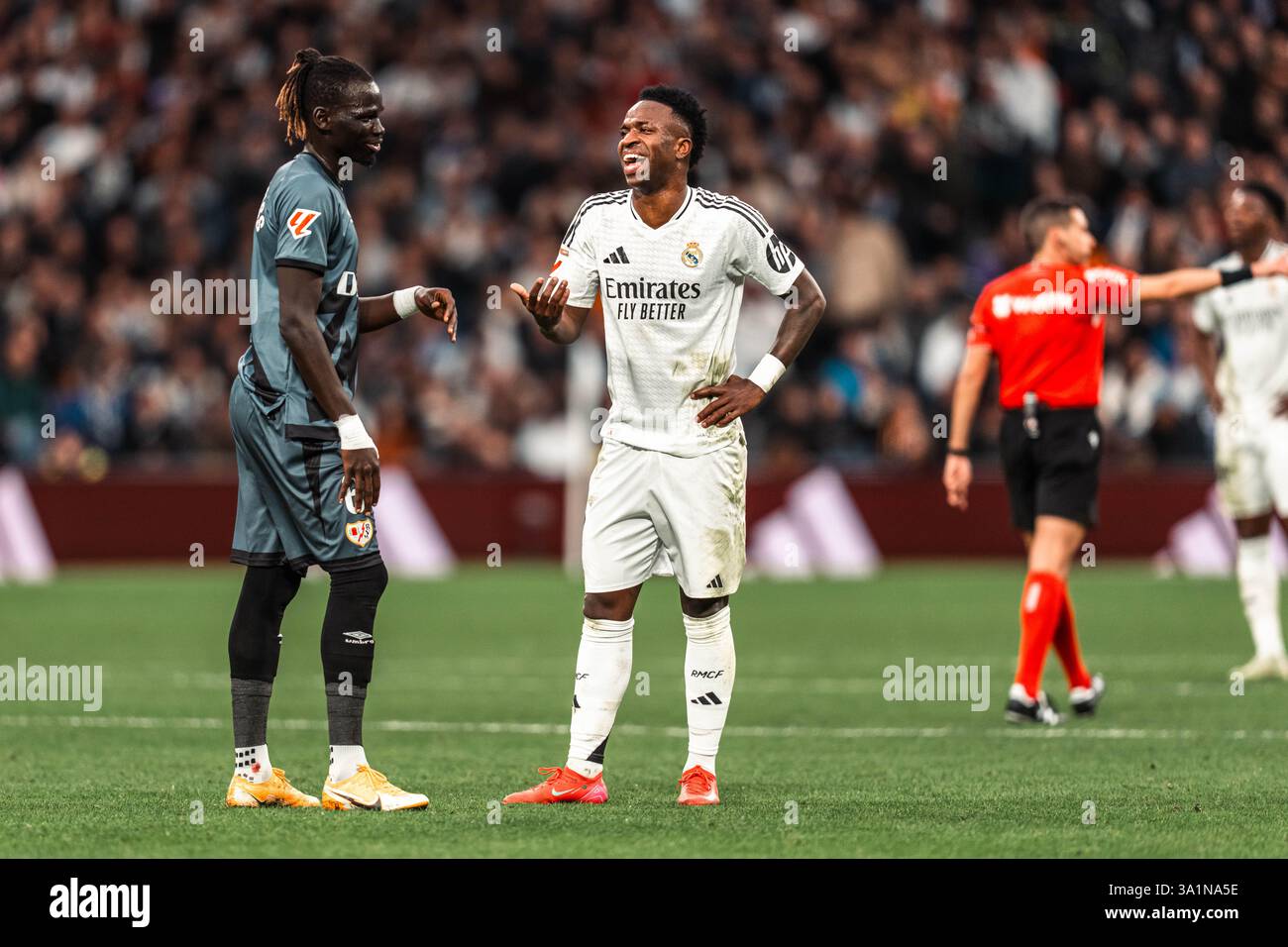 Vinicius Junior of Real Madrid CF and Pathe Ciss of Rayo Vallecano ...
