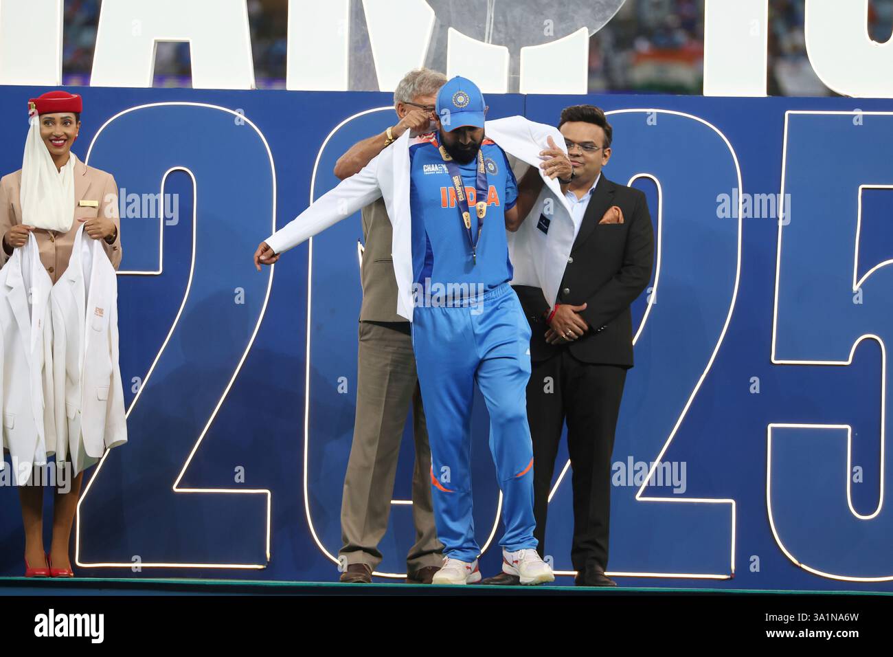 India's Mohammed Shami receives the white coat from BCCI President ...