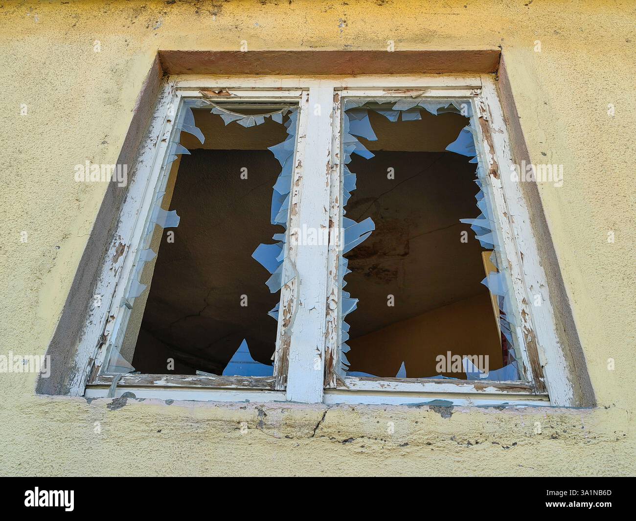 Shattered Past – Broken Window of an Abandoned House Stock Photo - Alamy
