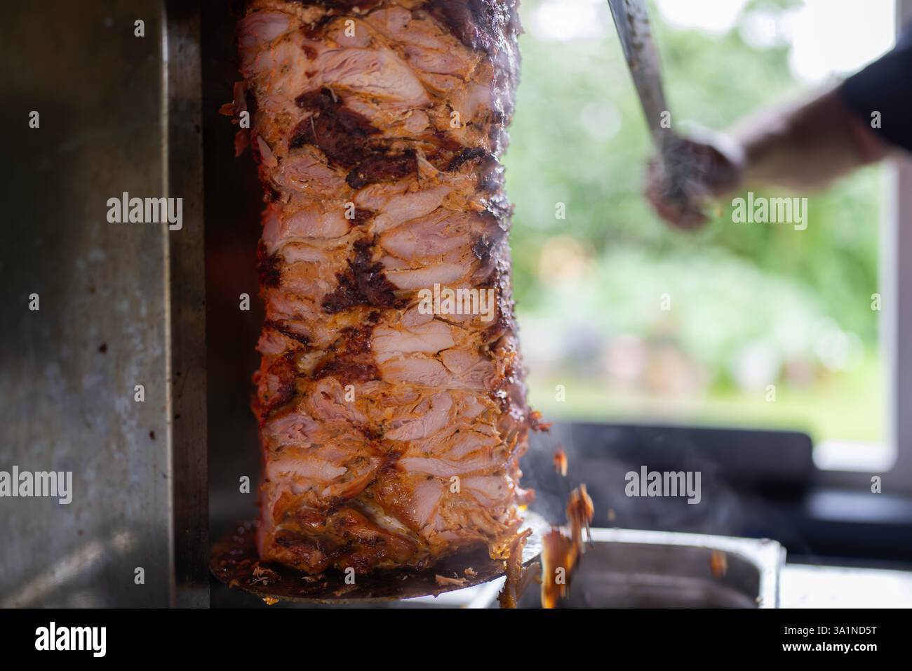 Chef preparing and making traditional turkish doner kebab meat. Grilled ...
