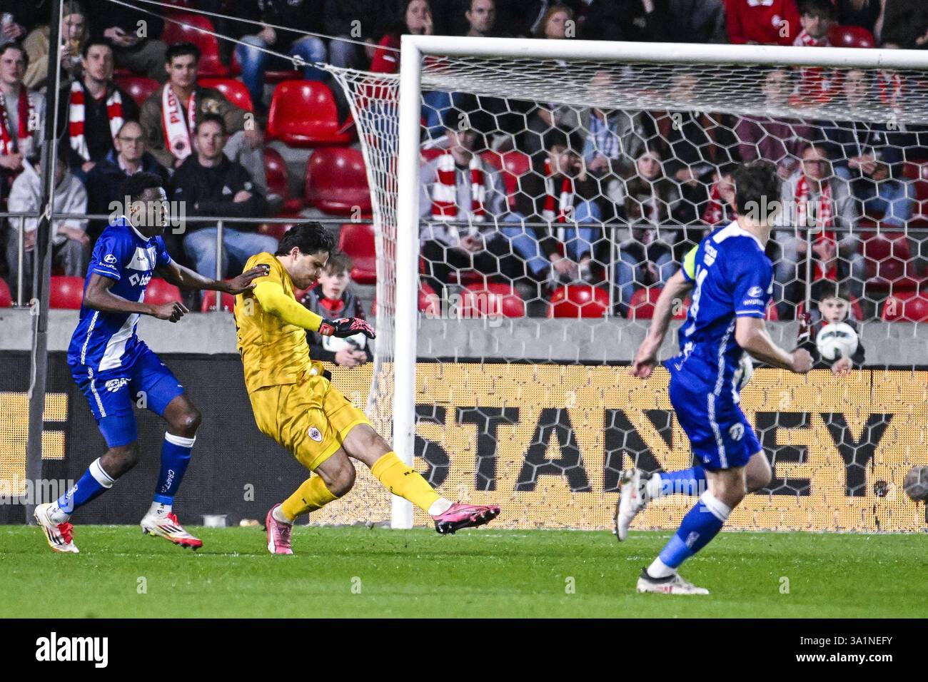 Gent's Hyllarion Goore and Antwerp's goalkeeper Senne Lammens pictured ...