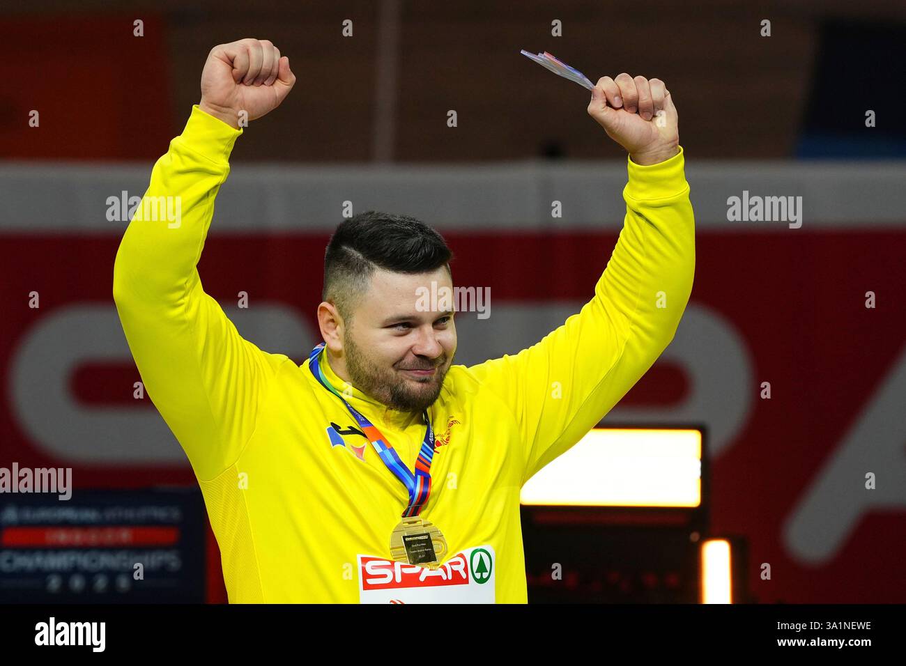 Gold medalist Romania's Andrei Rares Toader celebrates on the podium ...