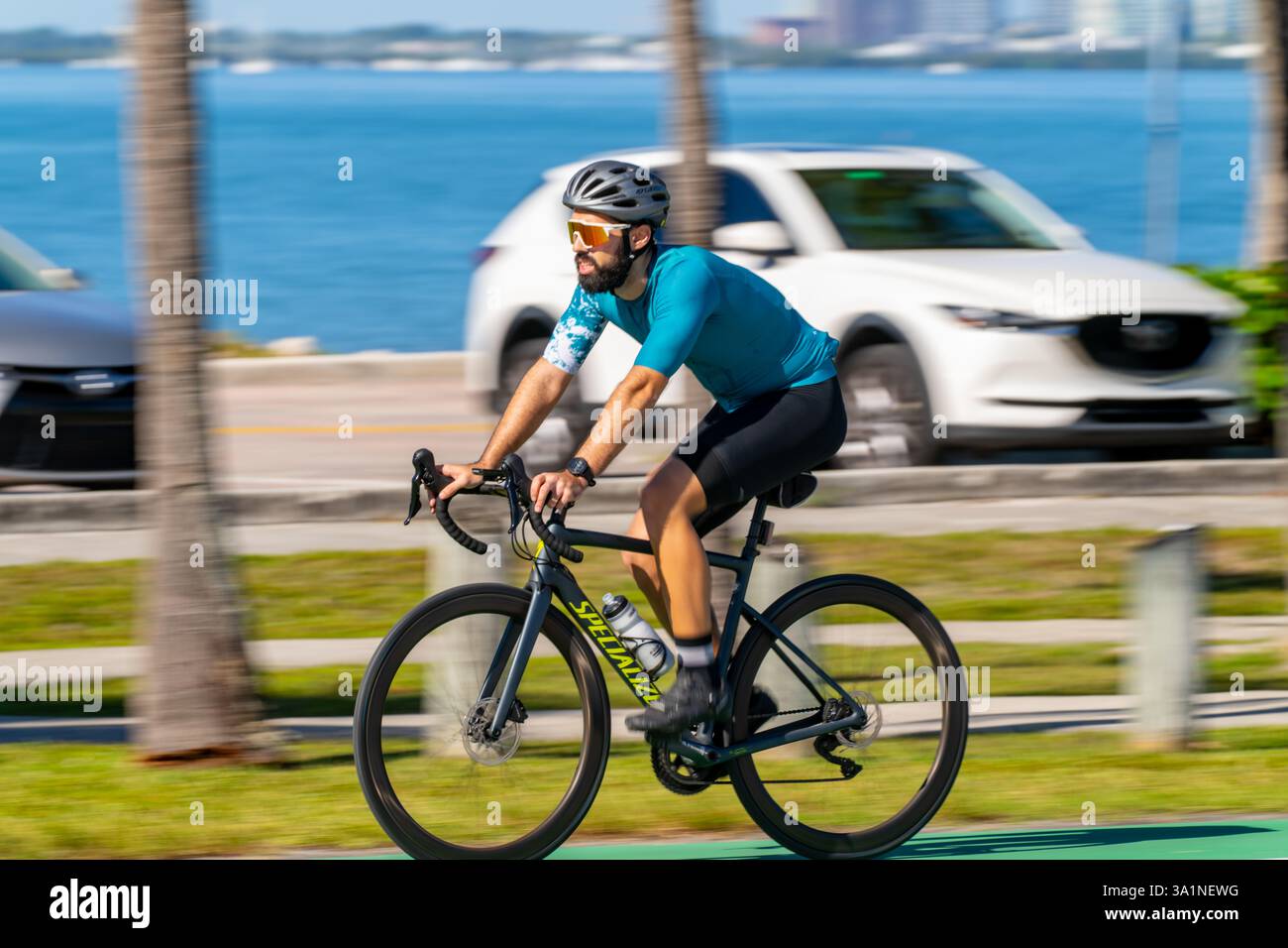 Key Biscayne Miami, FL, USA - March 8, 2025: Man riding a bike very ...