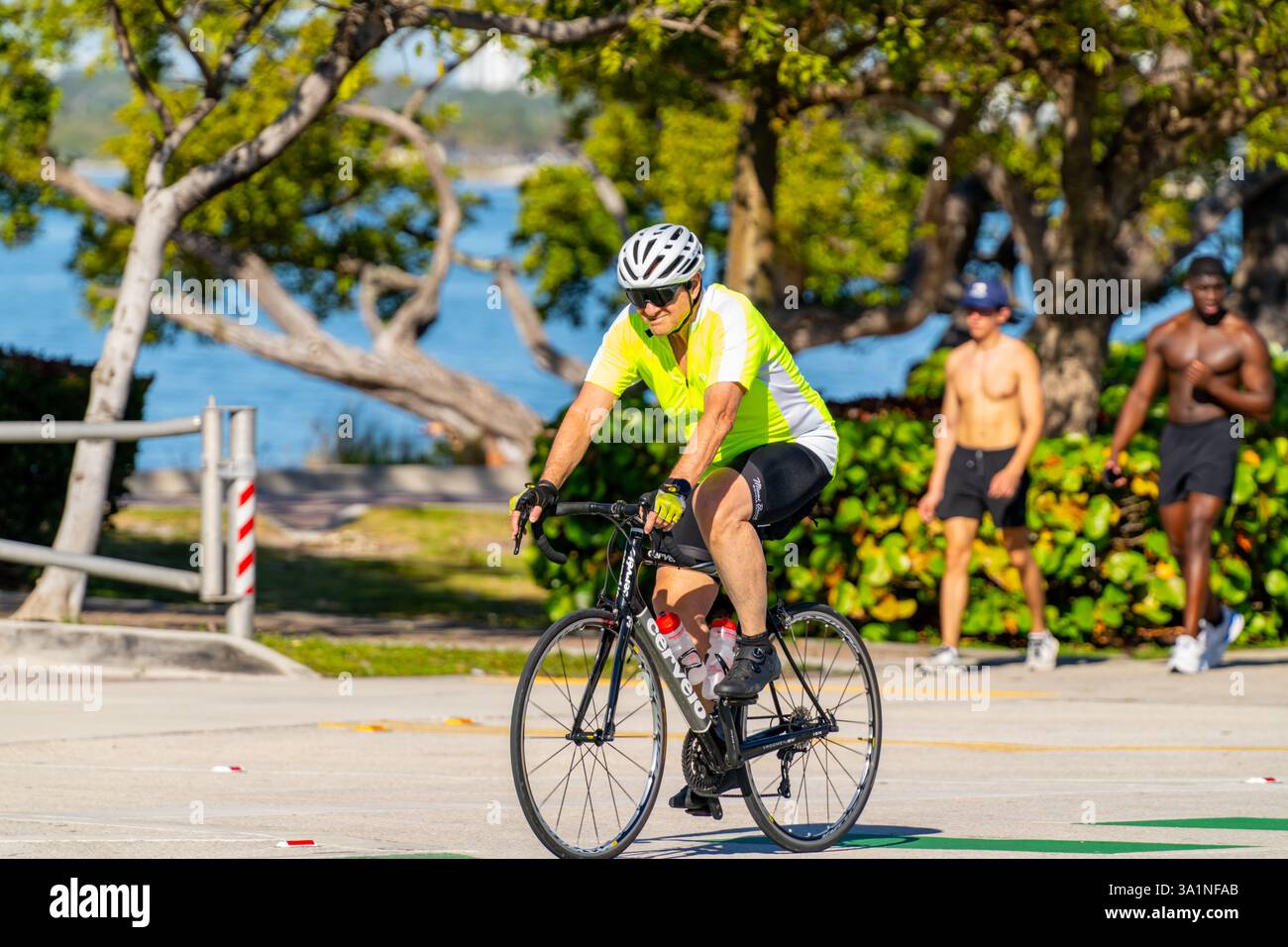 Key Biscayne Miami, FL, USA - March 8, 2025: Senior adult man riding a ...