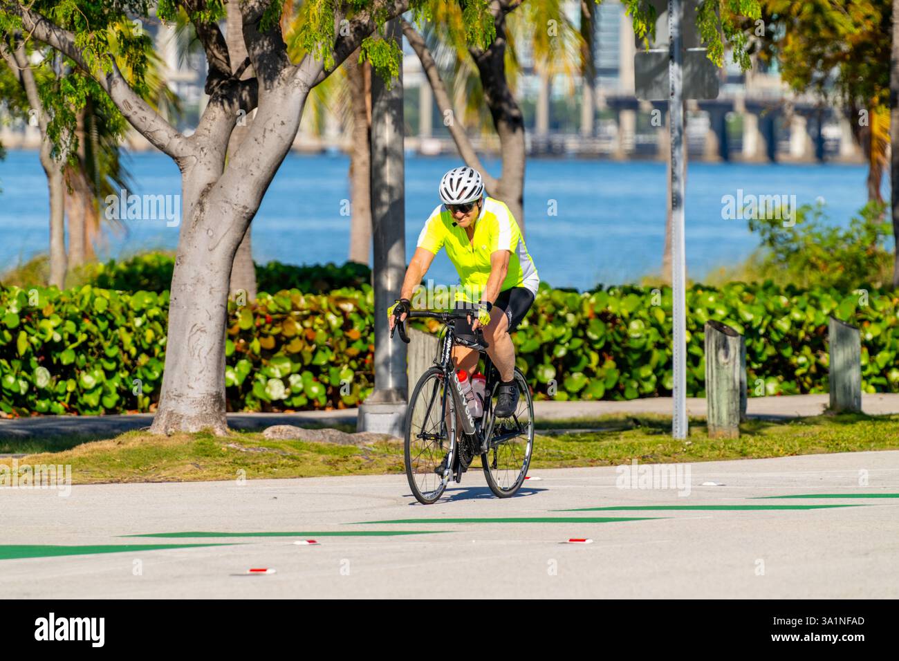 Key Biscayne Miami, FL, USA - March 8, 2025: Senior adult man riding a ...