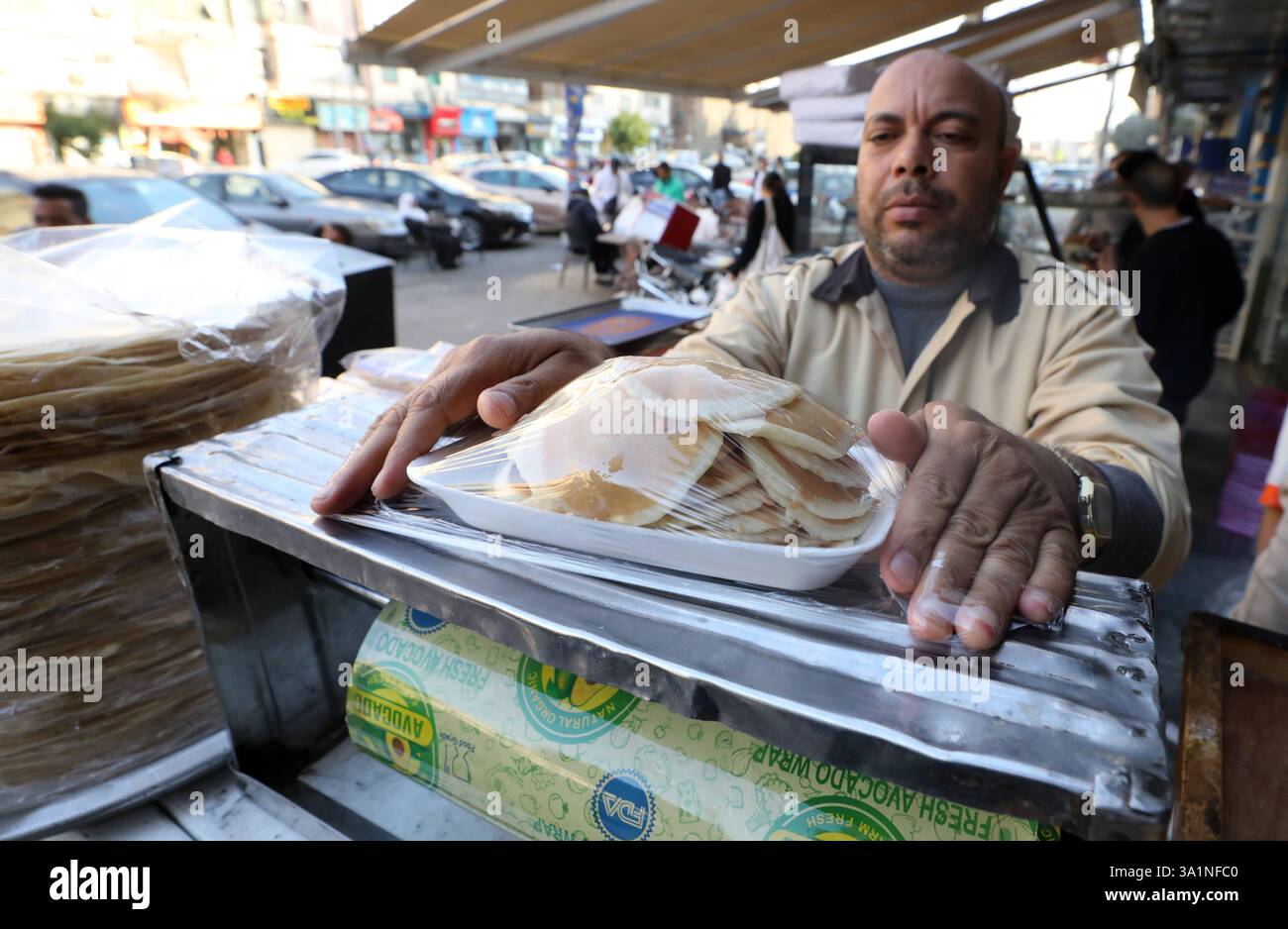 Bakers prepare dessert during Ramadan, Egypt An Egyptian baker prepares ...