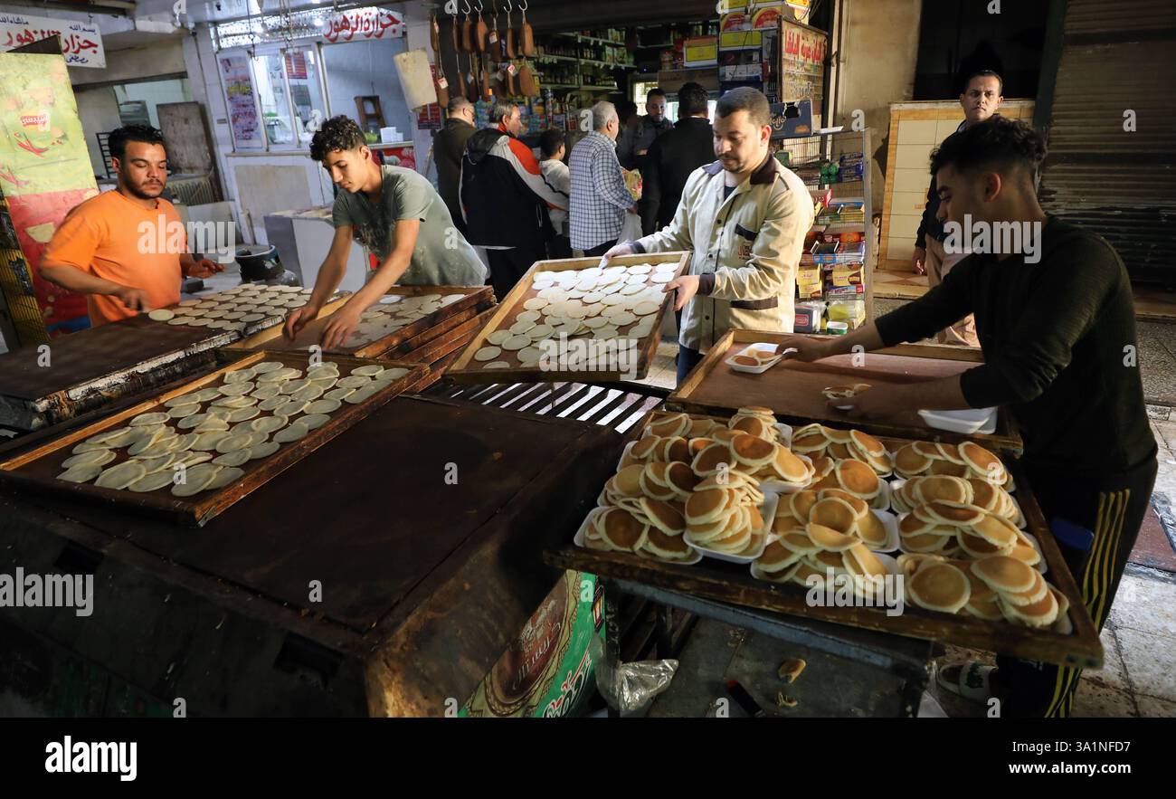 Bakers prepare dessert during Ramadan, Egypt An Egyptian baker prepares ...