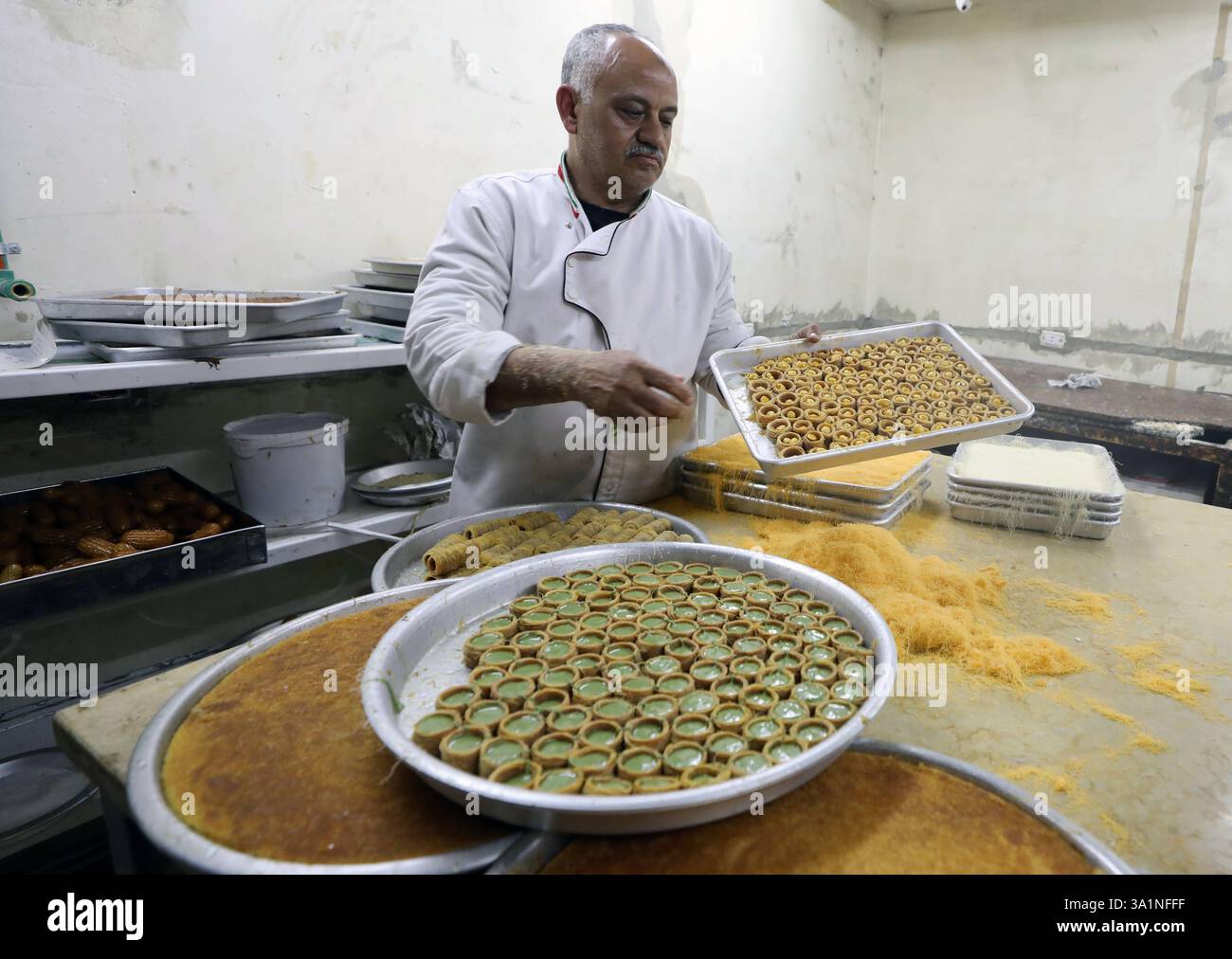 Bakers prepare dessert during Ramadan, Egypt An Egyptian baker prepares ...