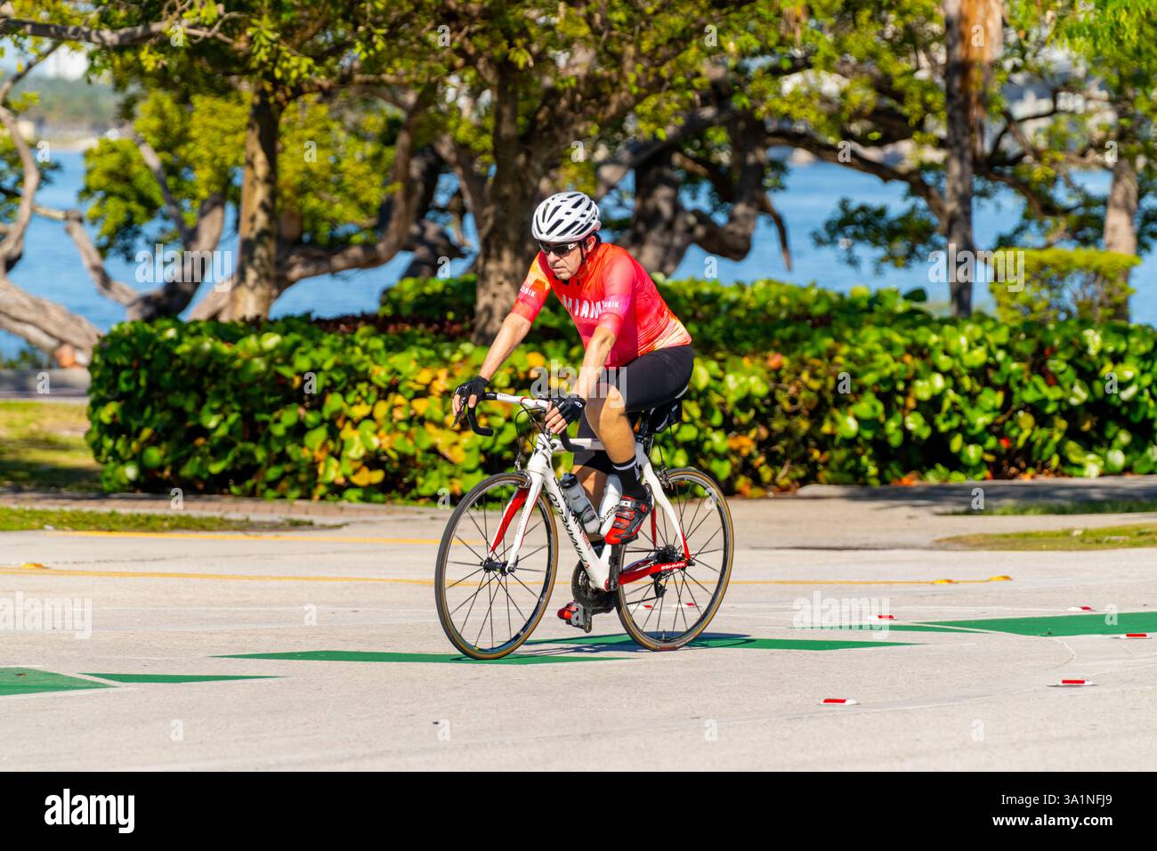 Key Biscayne Miami, FL, USA - March 8, 2025: Man cycling to stay in ...