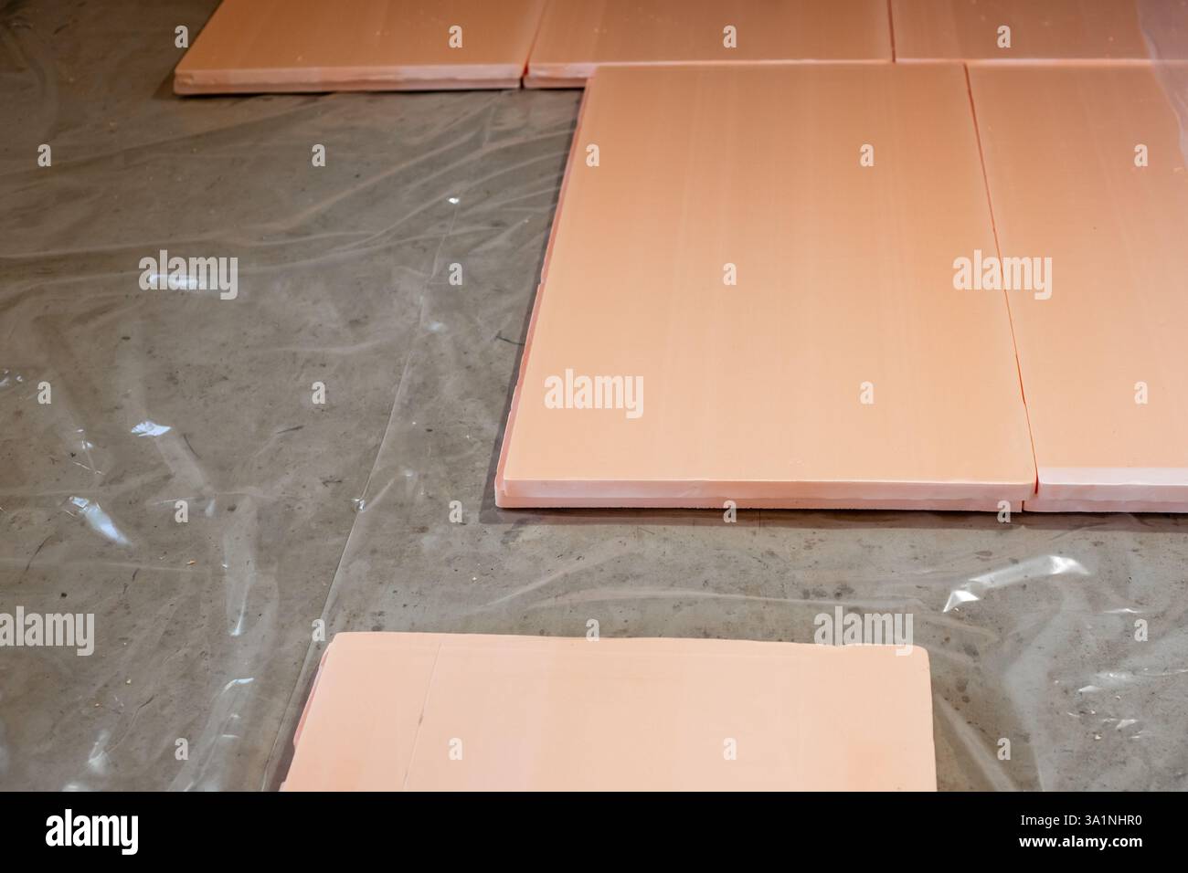 polystyrene foam is laid on the floor on a waterproofing film ...