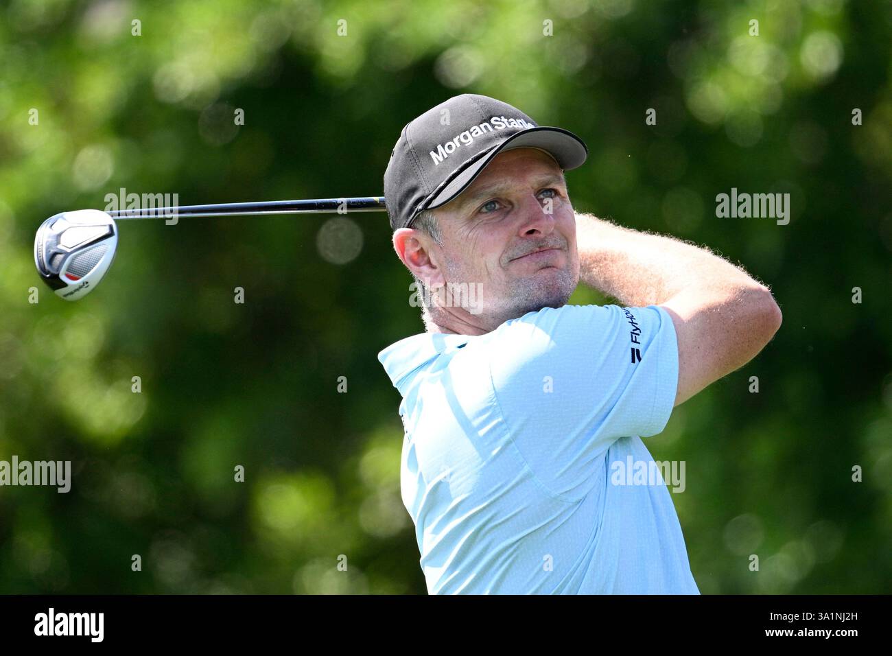 Justin Rose, of England, tees off on the first hole during the final ...