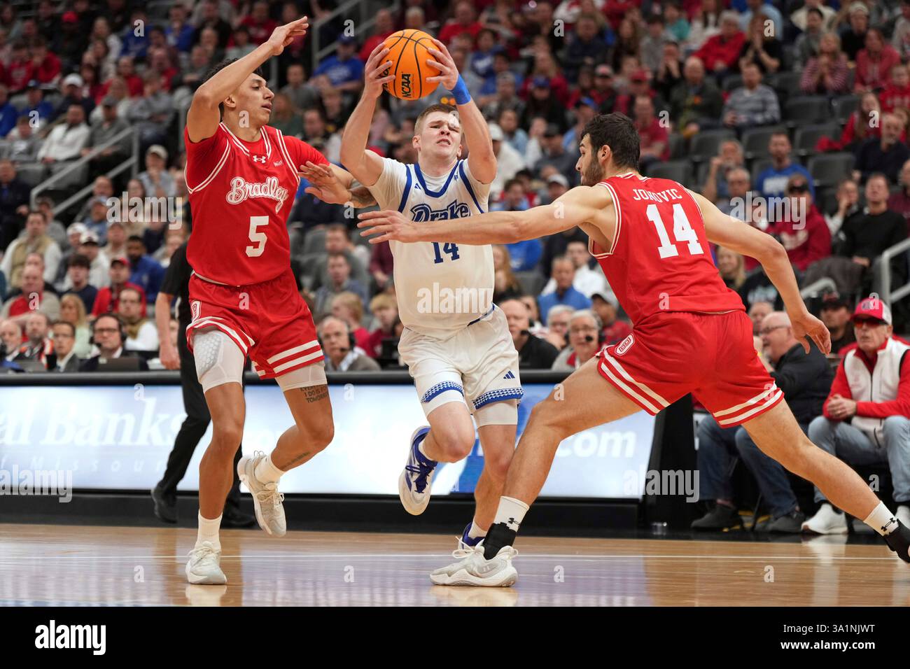 Drake's Bennett Stirtz reaches a loose ball as Bradley's Christian ...
