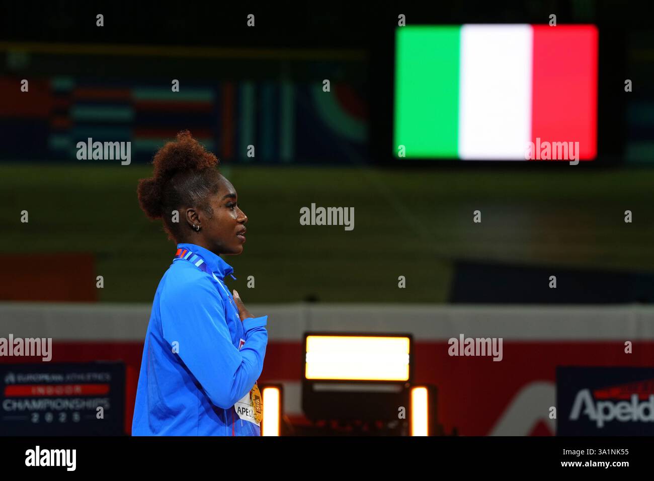 Winner Italy's Zaynab Dosso celebrates on the podium for the 60m Women ...