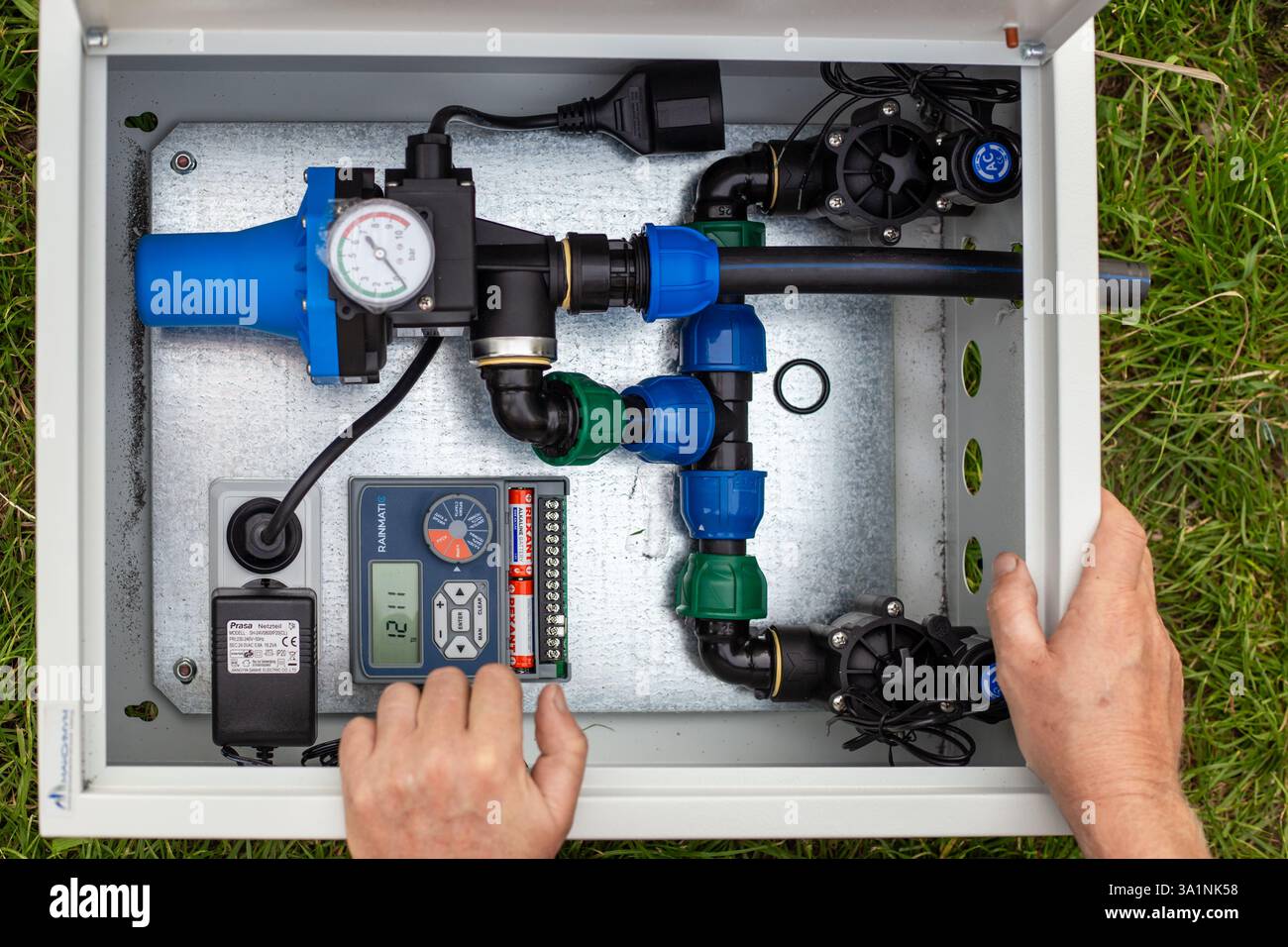 Installation of an automated drip irrigation system for a garden in a ...