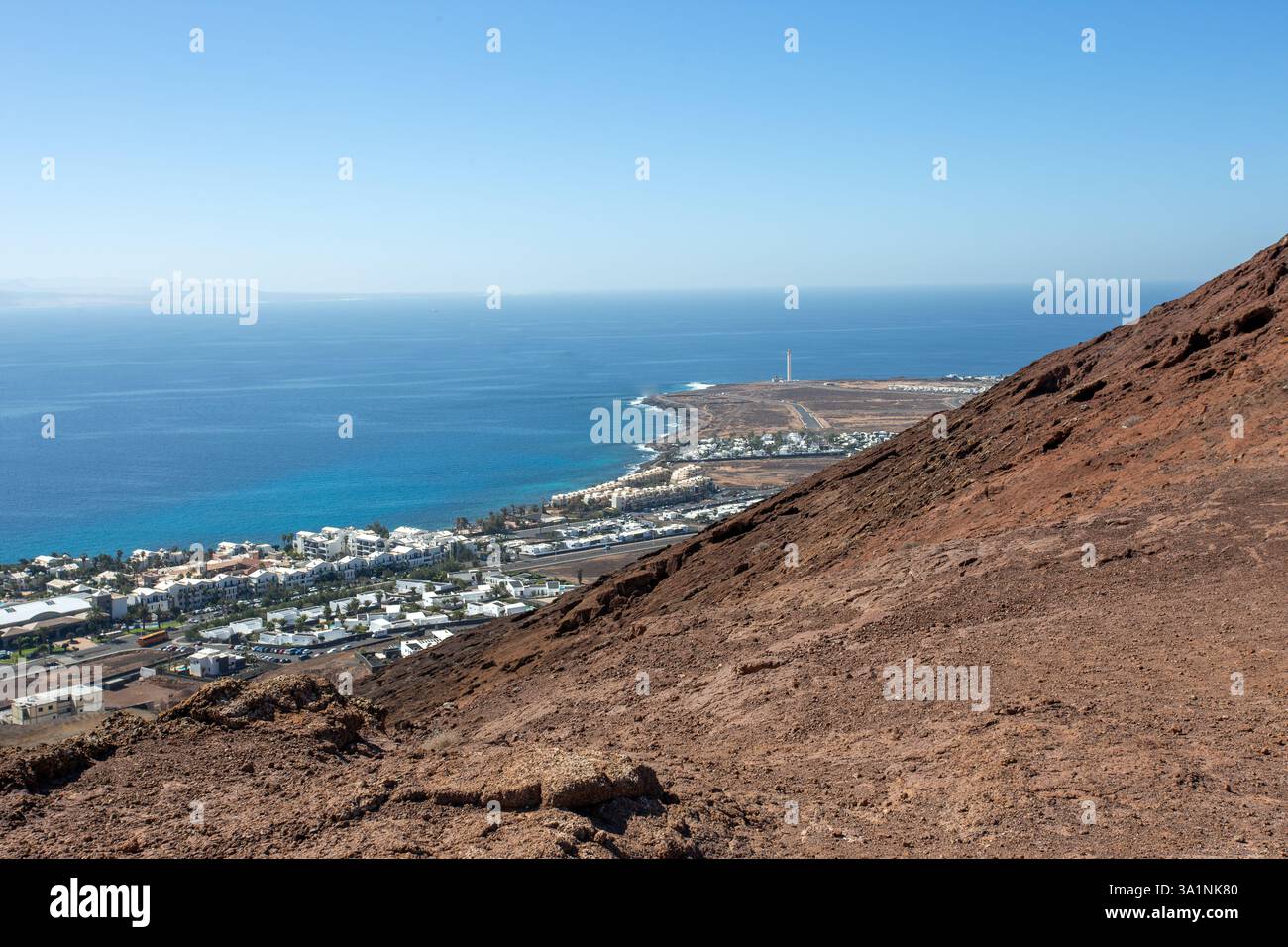 View towards the lighthouse from the Red Montana Montana Baja mountain ...