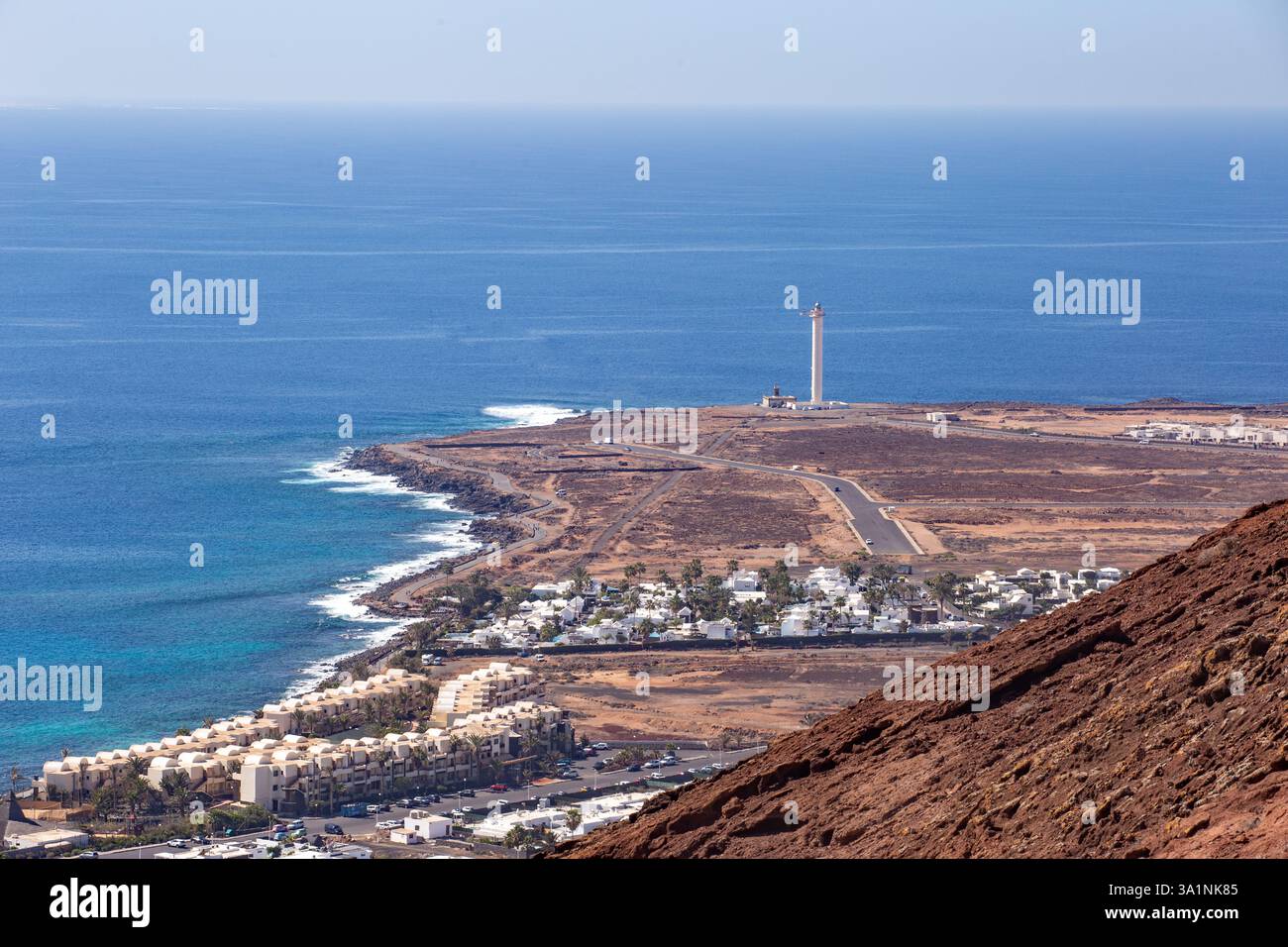 View towards the lighthouse from the Red Montana Montana Baja mountain ...