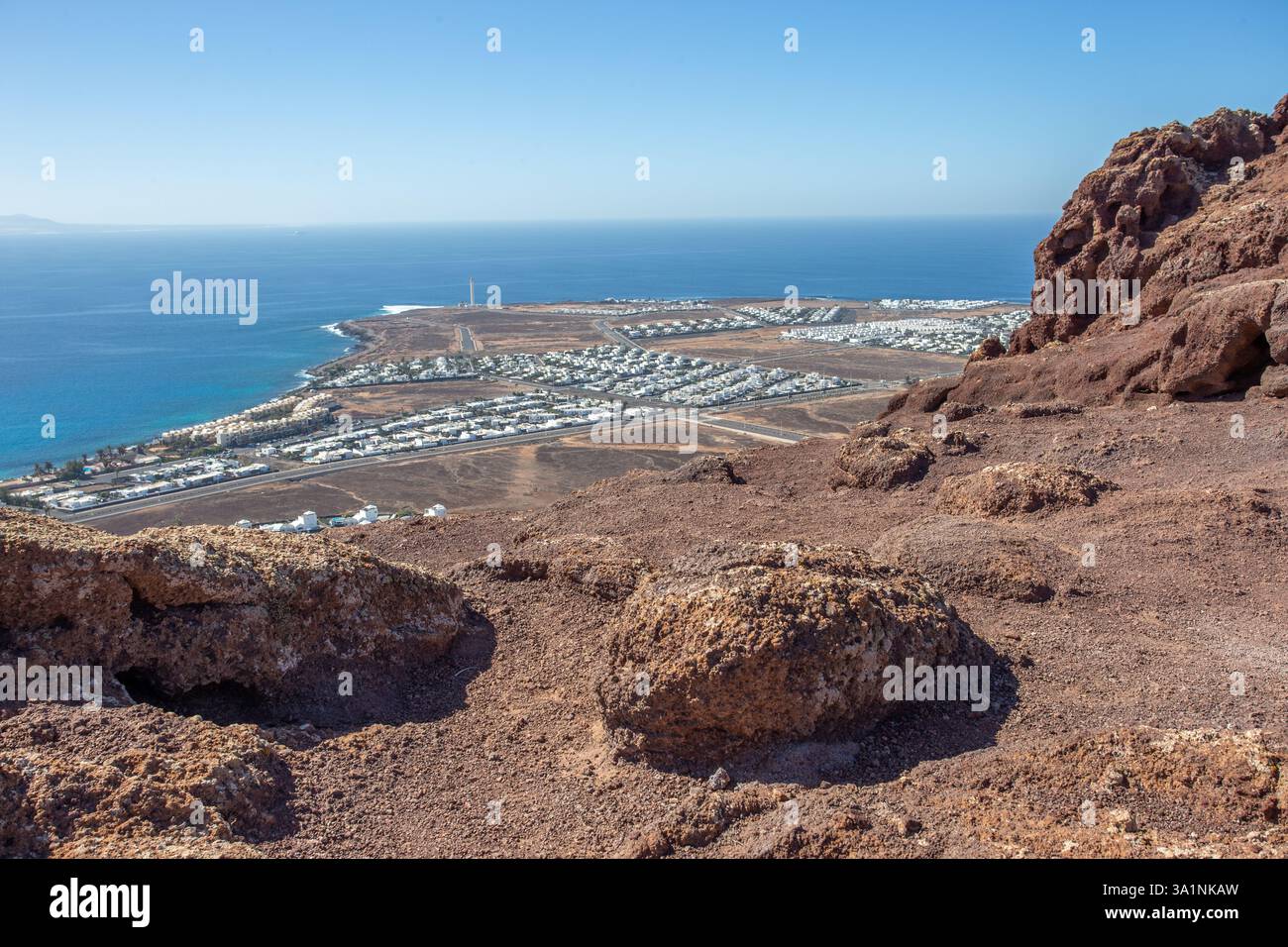 View towards the lighthouse from the Red Montana Montana Baja mountain ...