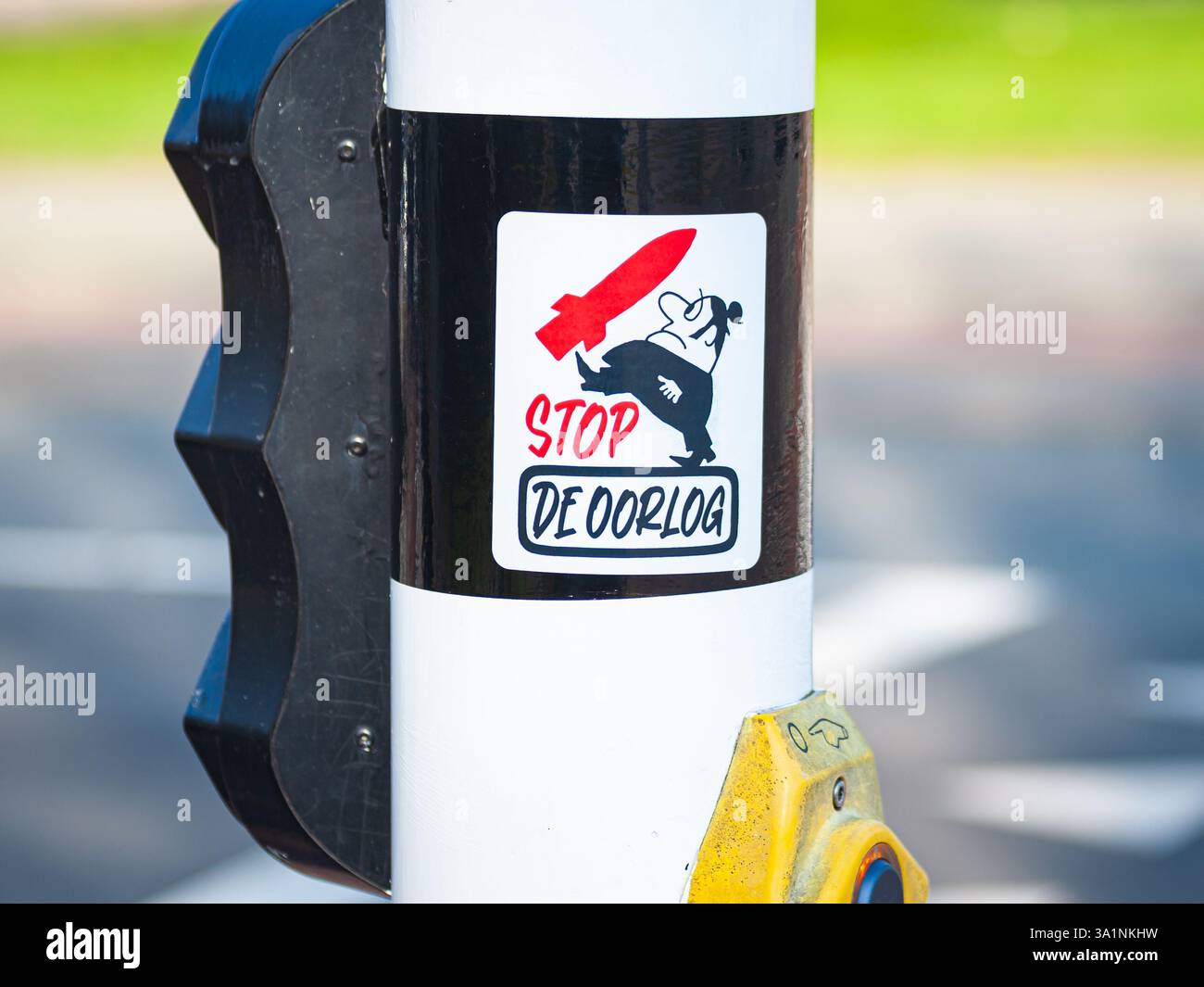 Anti-war sticker on a traffic pole with text Stop the War (Dutch:Stop ...