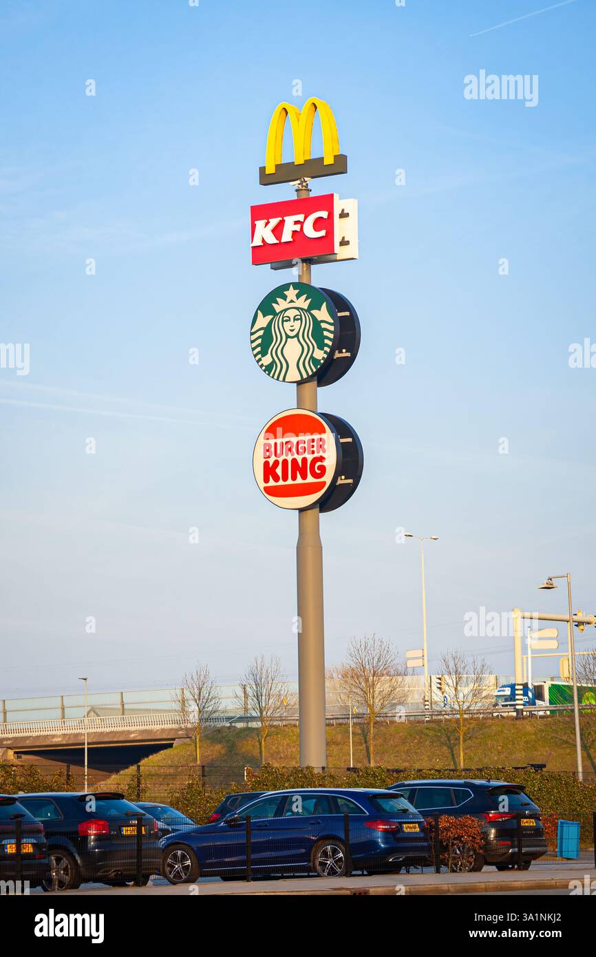 Advertising pole showing the logos of fast food chains Mc Donalds, KFC ...