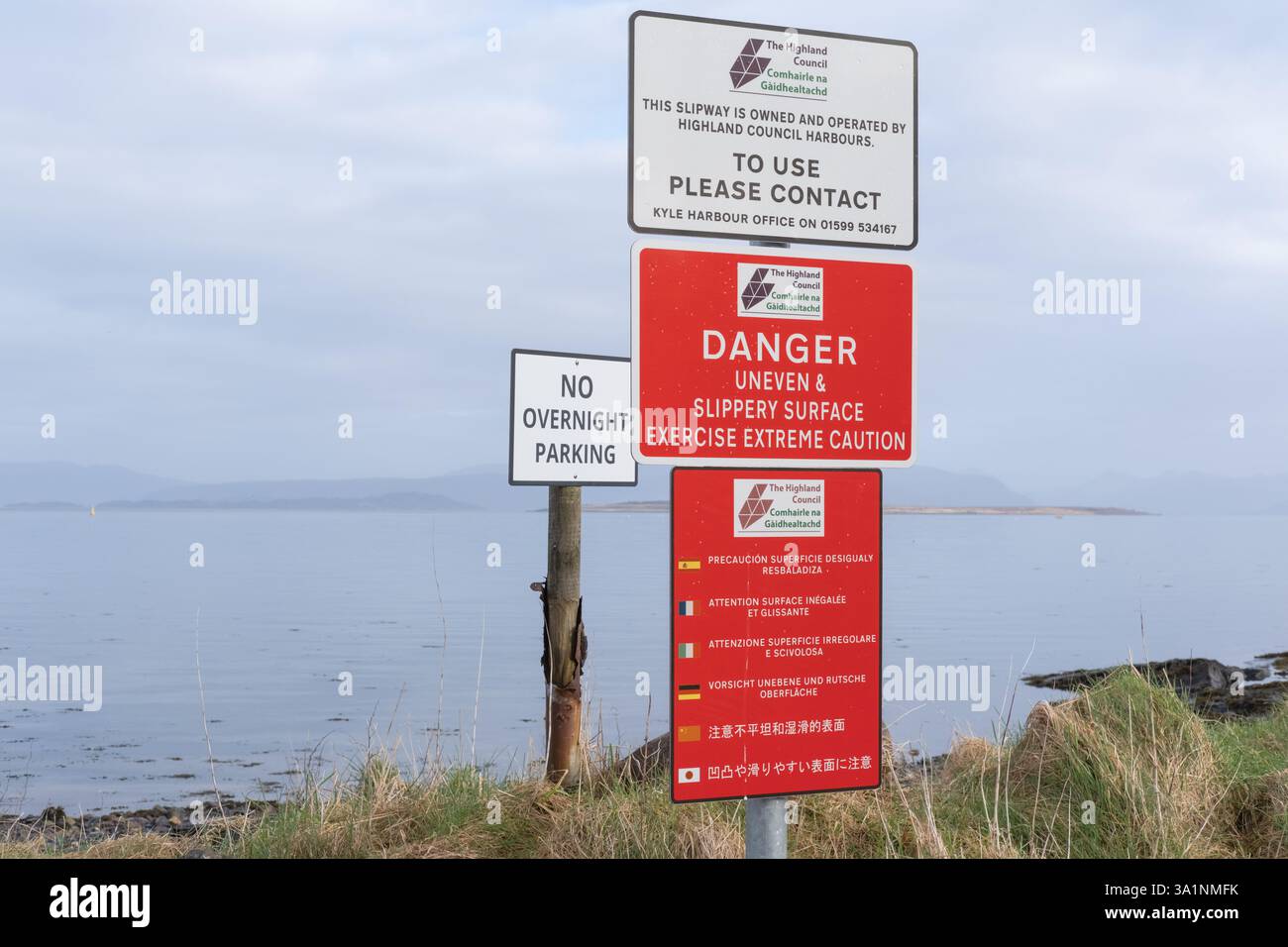 Various public information and warning signs beside the slipway in ...
