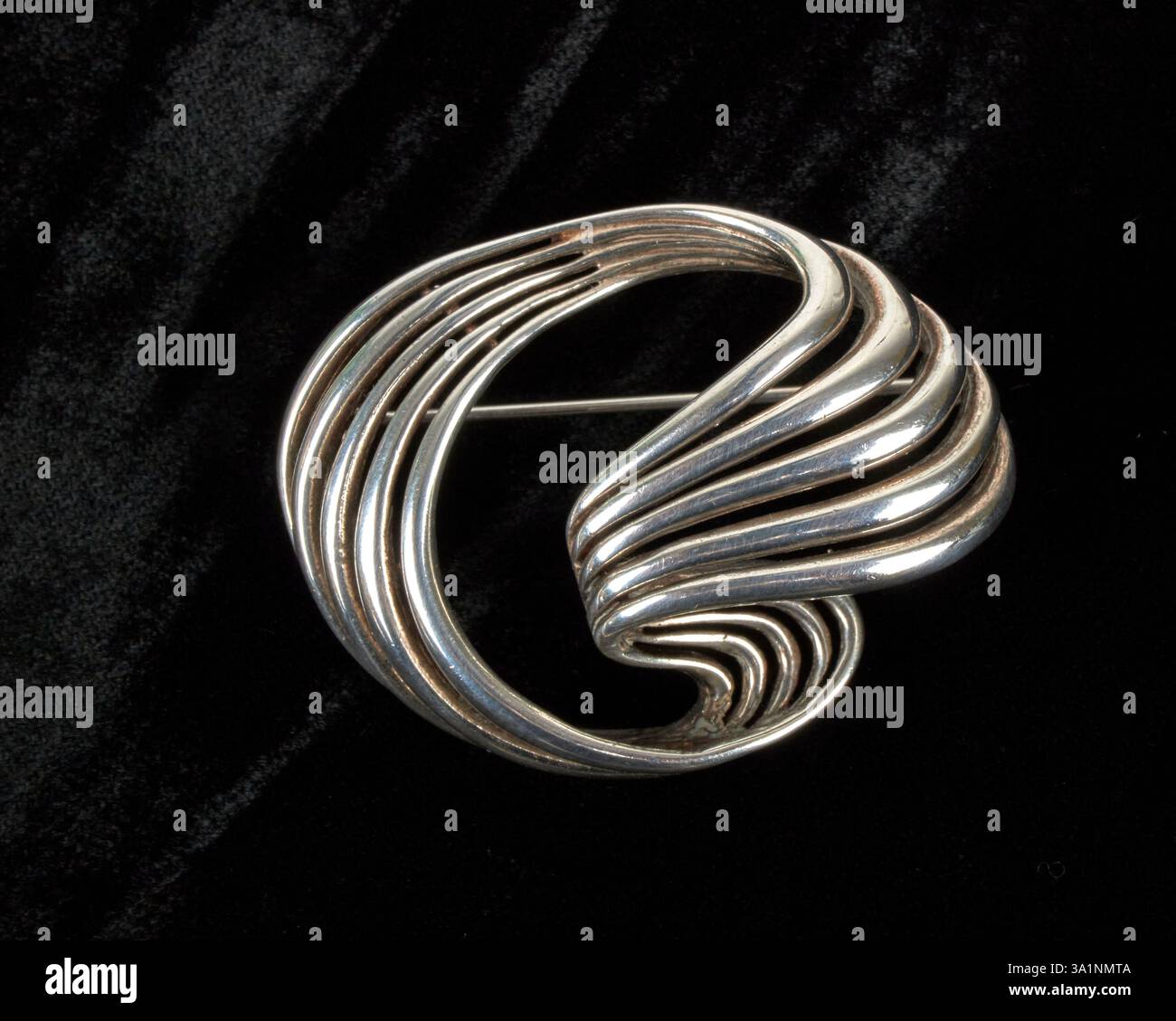 Sculptural Silver Whiplash Brooch 1975 Stock Photo - Alamy