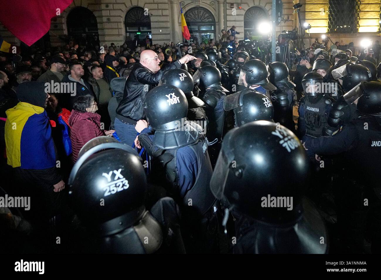 Supporters of Calin Georgescu react during a protest after Romania's ...