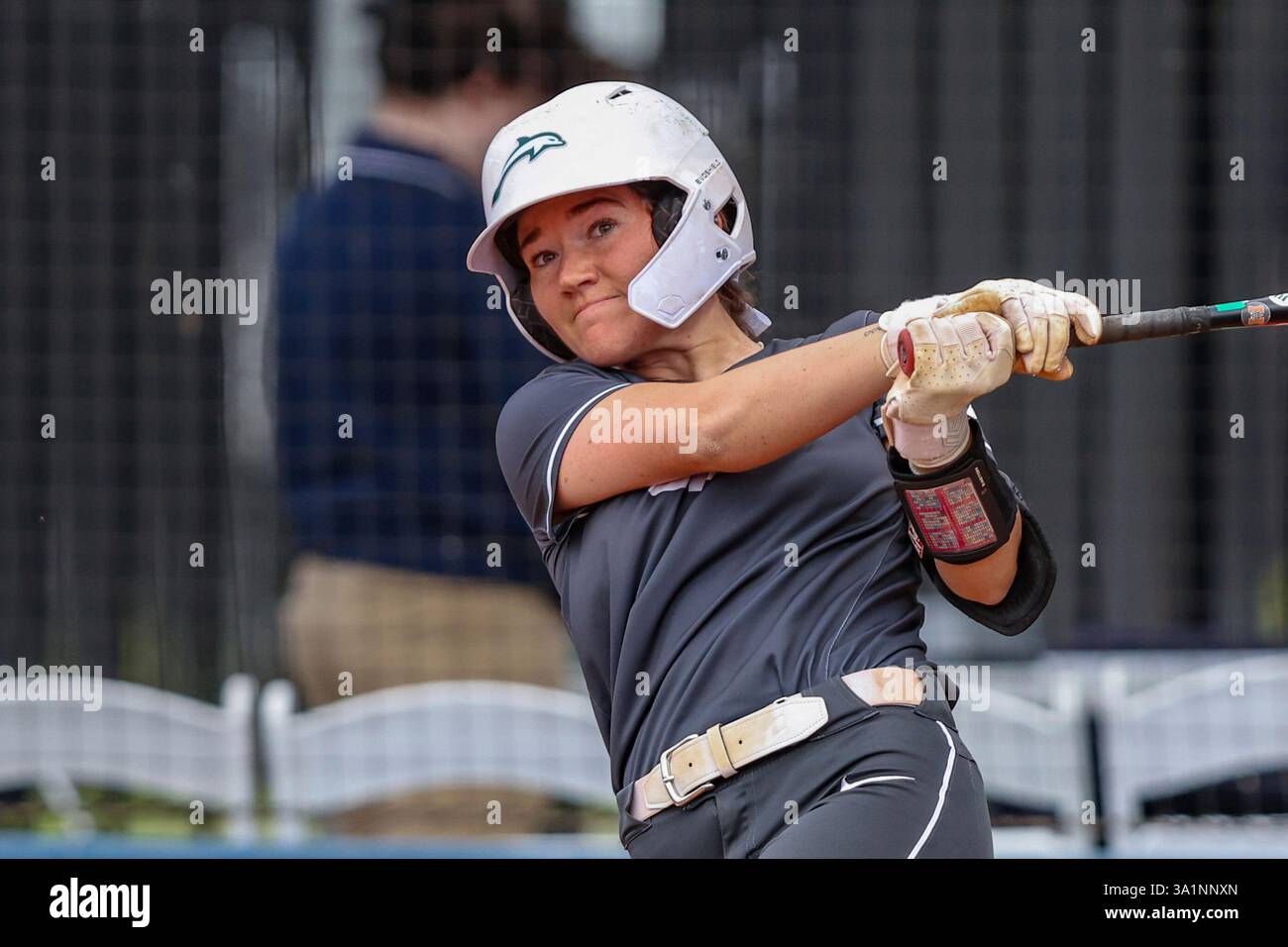Jacksonville catcher Gabby Baylog (5) bats during an NCAA softball game ...