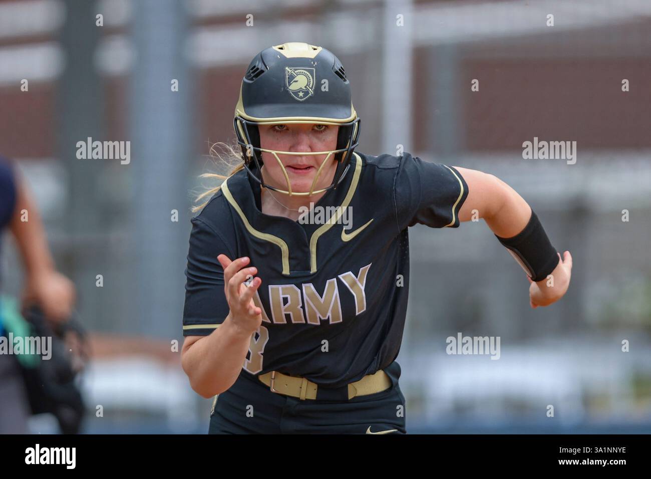 Army catcher Sam Rodgers (8) runs to first base during an NCAA softball ...
