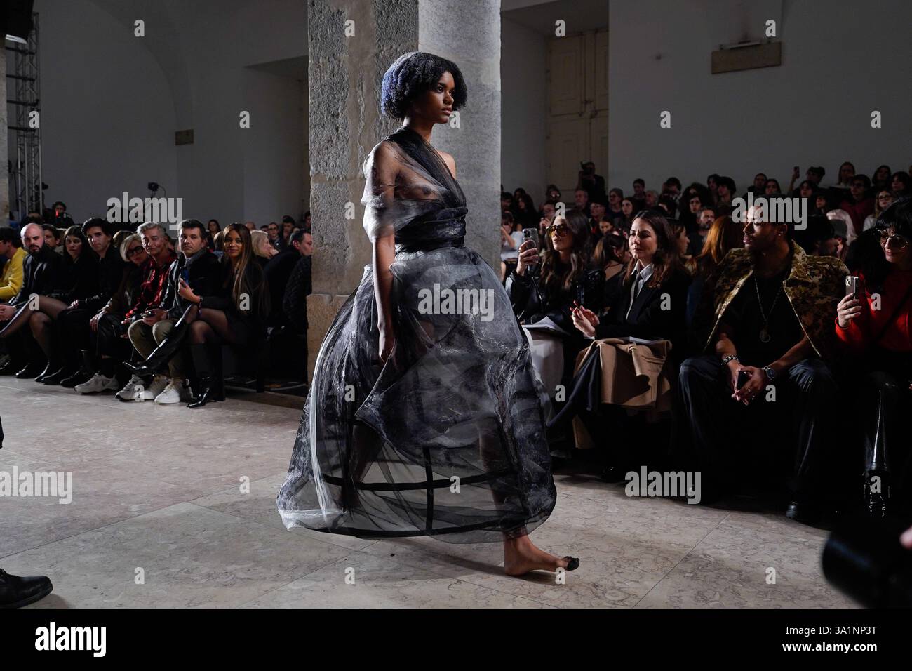 Lisbon, Portugal. 08th Mar, 2025. A model walks the runway during ...