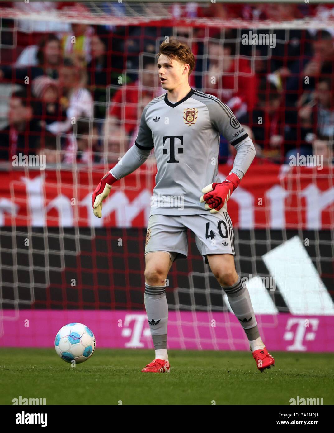MUNICH, GERMANY - MARCH 08: Jonas Urbig of Bayern Muenchen in action ...