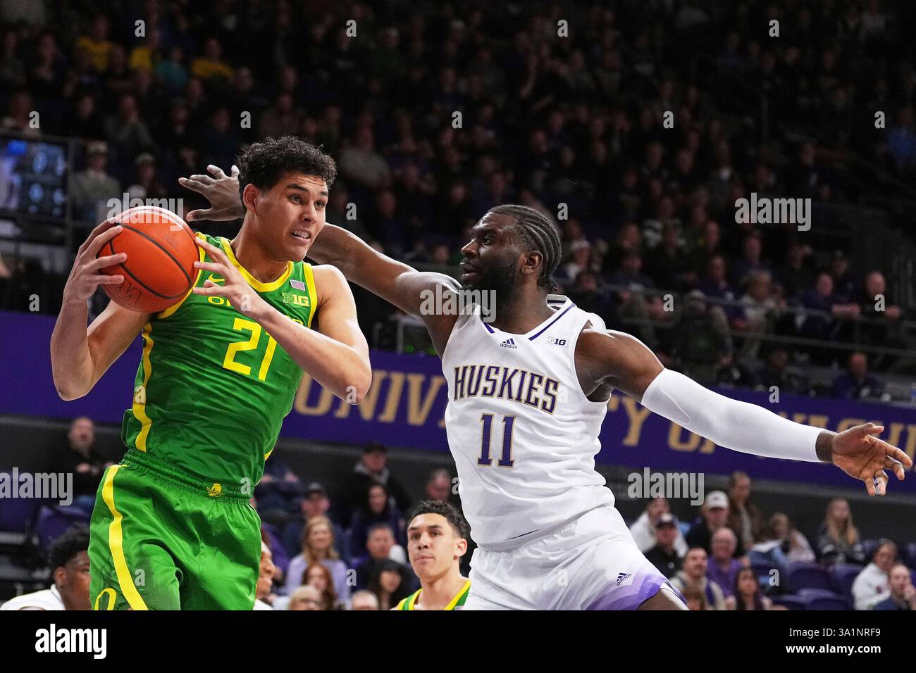 Oregon forward Brandon Angel (21) grabs the rebound against Washington ...