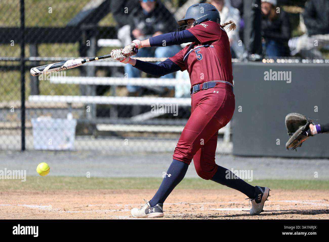 Fairleigh Dickinson infielder Erika Barela (5) takes a swing during an ...