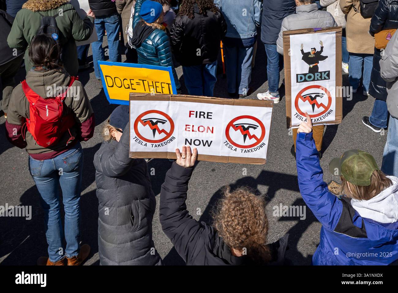 NEW YORK, NEW YORK - MARCH 8: A protestor outside a Tesla showroom in ...