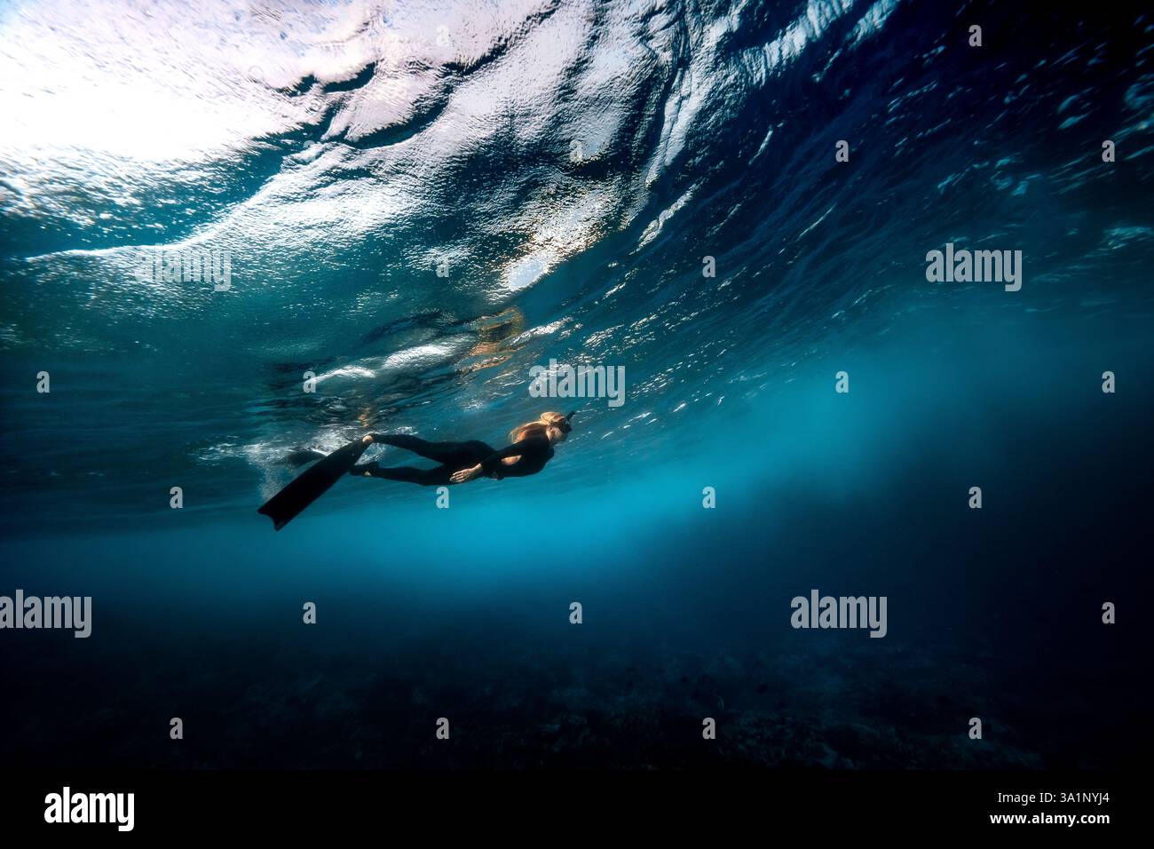 Diving into waves Stock Photo - Alamy