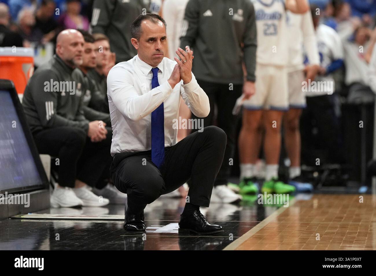 Drake head coach Ben McCollum applauds during the second half against ...