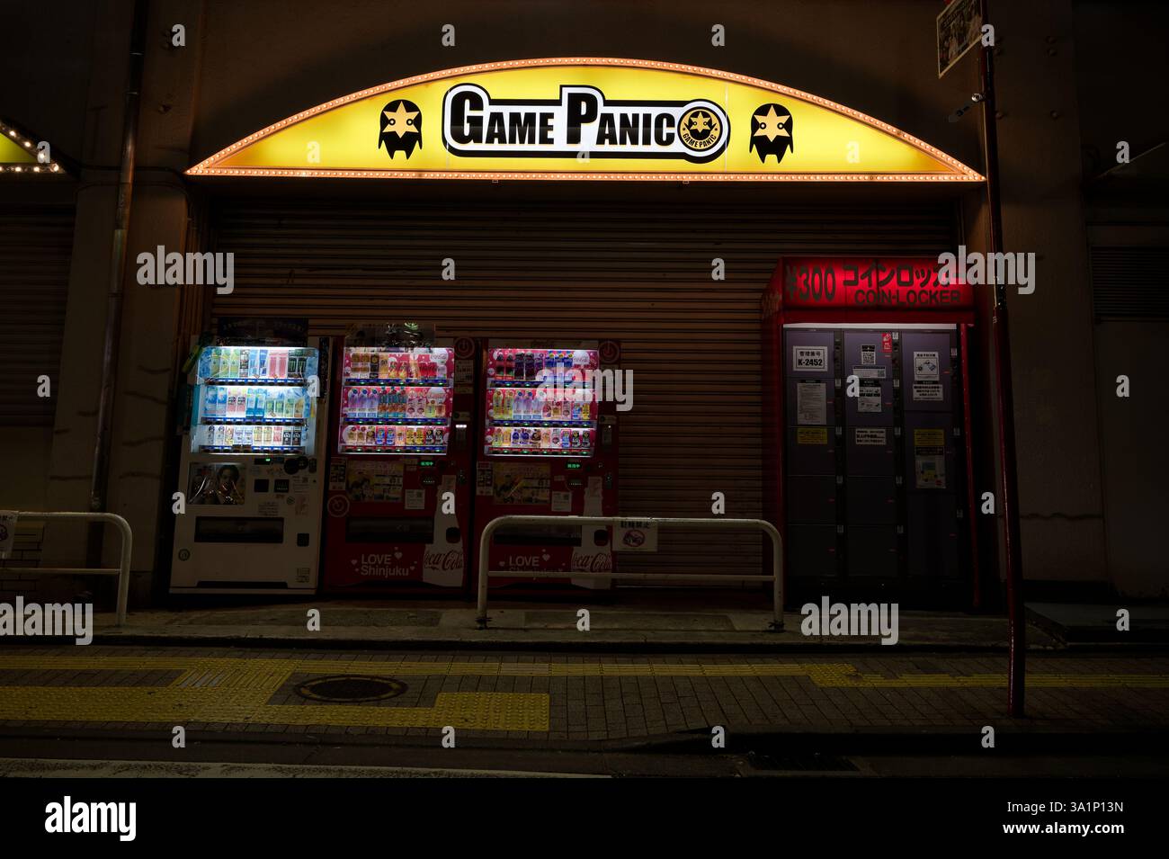 Closed arcade in Shinjuku with glowing vending machines and coin ...