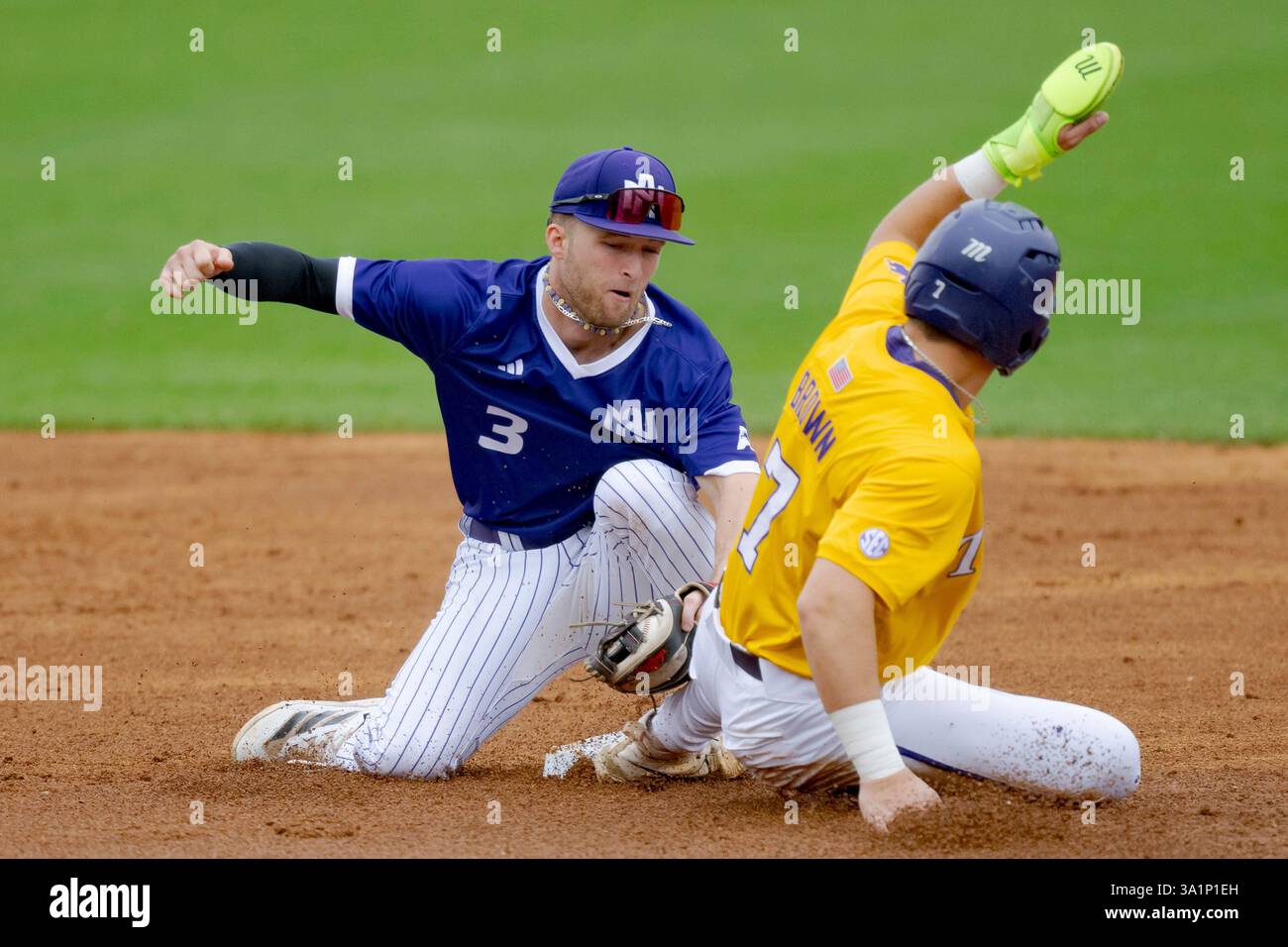 North Alabama infielder Leighton Jenkins (3) tags out LSU utility Jake ...